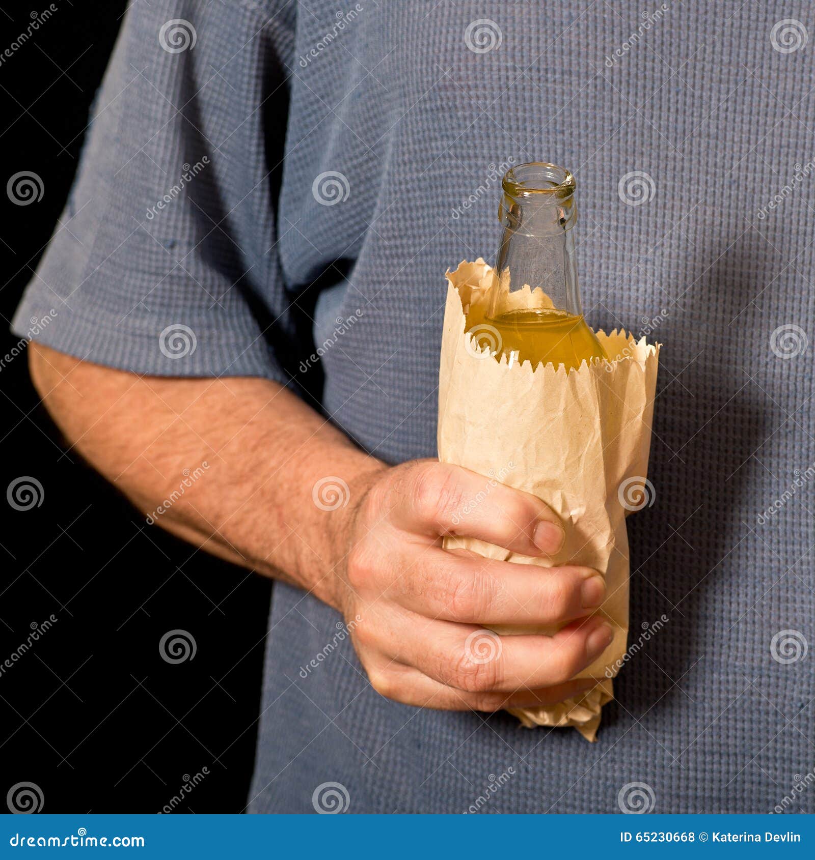 Drinker Holds a Bottle in the Paper Bag Stock Photo - Image of beverage ...