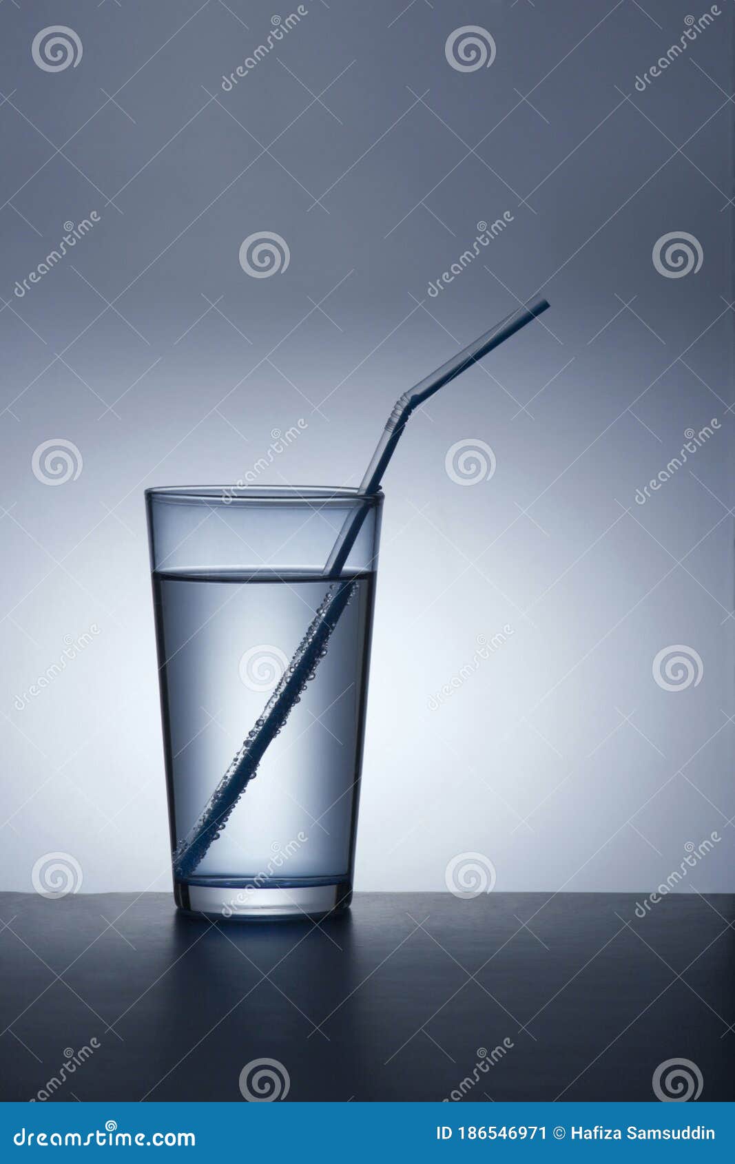 Drinking Straw in a Glass of Water. Conceptual Image Stock Image ...