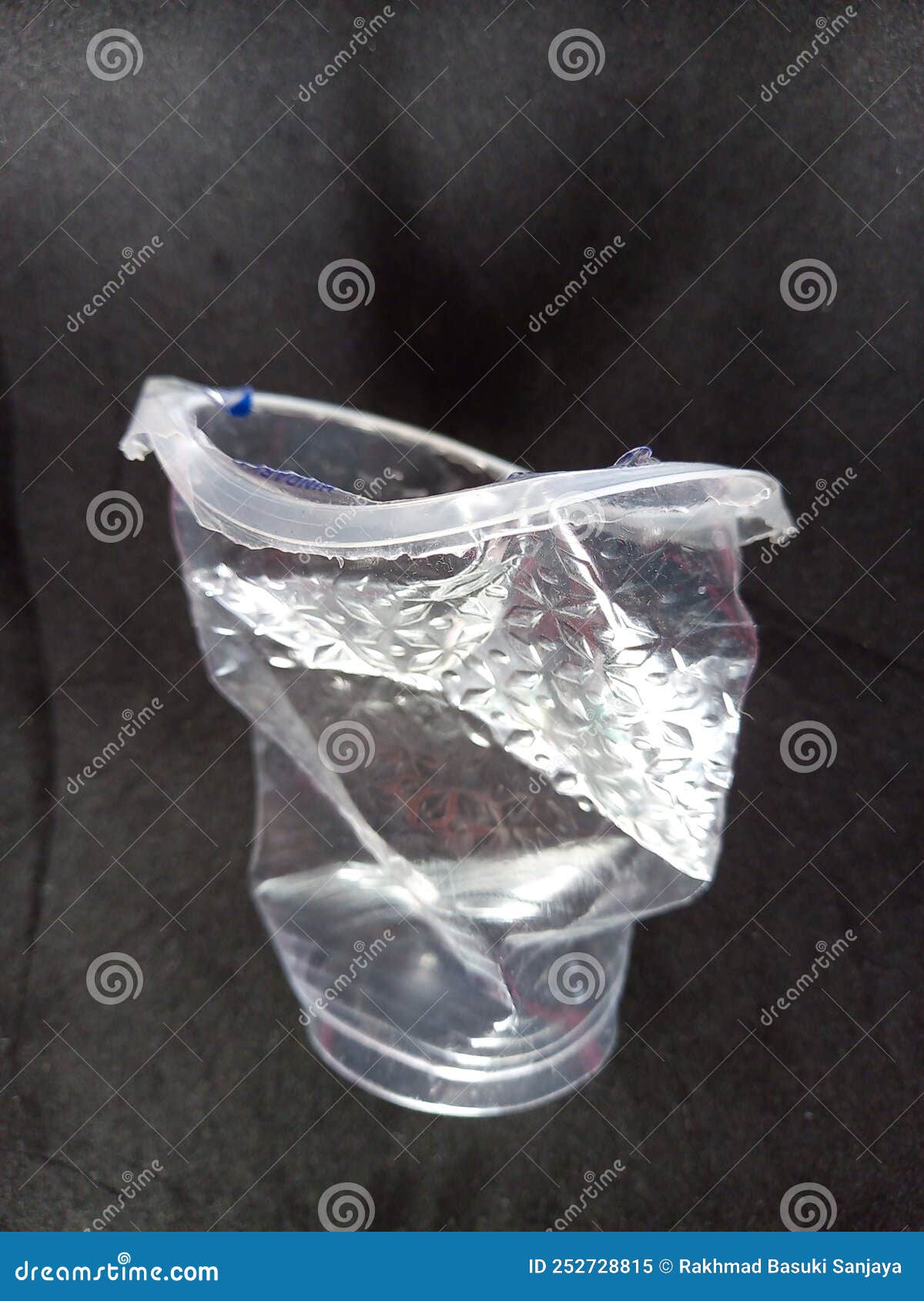 Drinking Water in an Empty Plastic Cup. Single Use Cup Stock Image ...