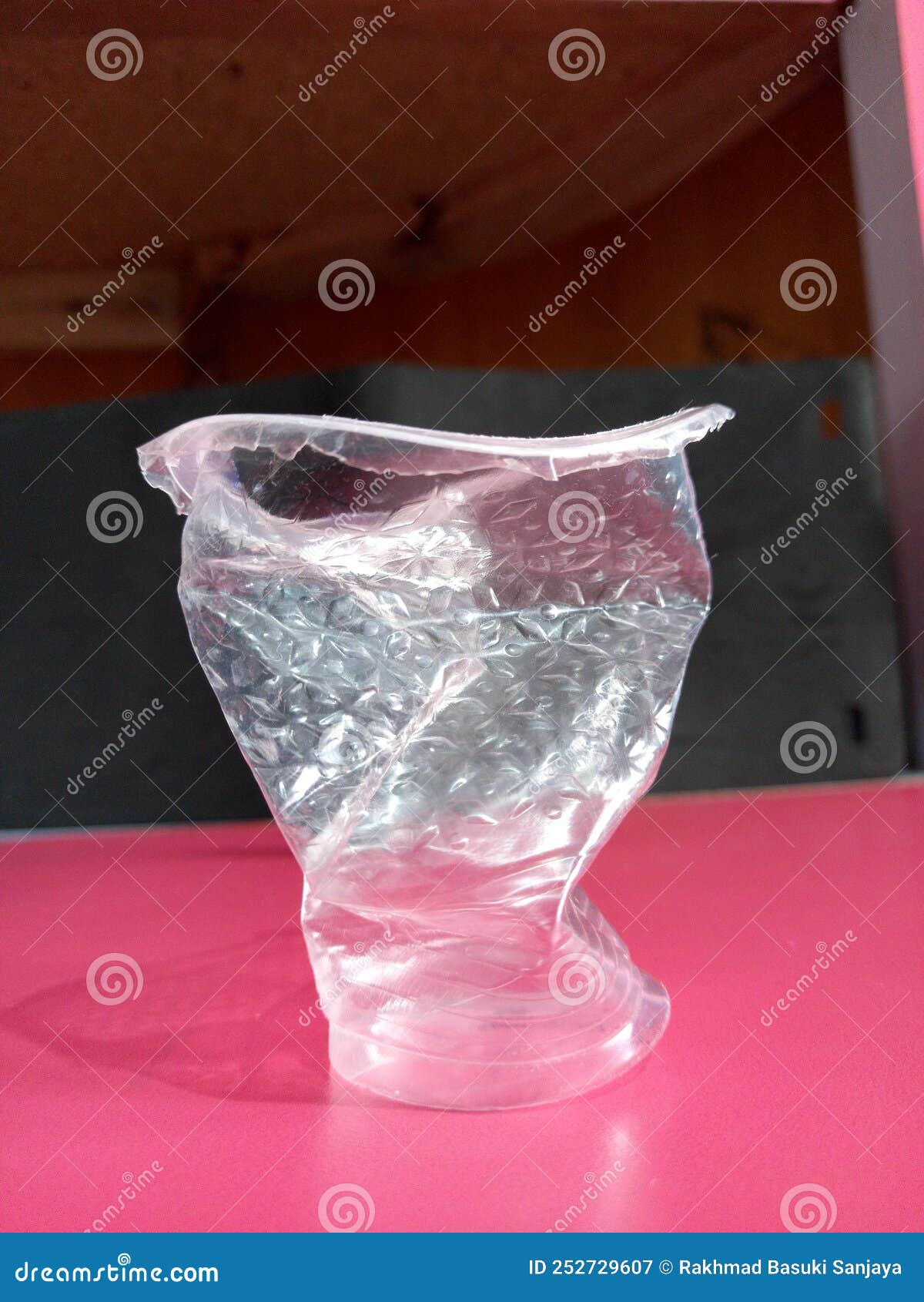 Drinking Water in an Empty Plastic Cup. Single Use Cup Stock Image ...