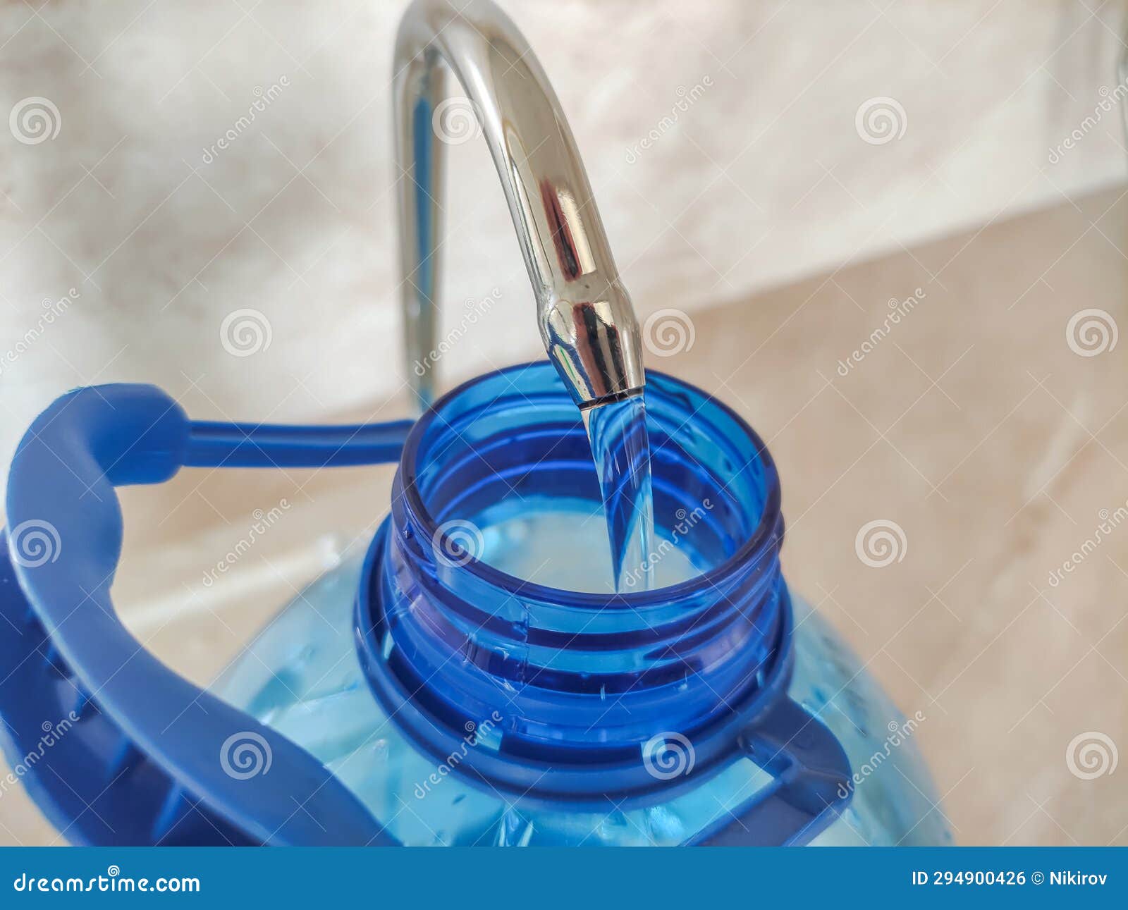Drinking Water from a Tap is Collected into a Bottle Stock Photo ...
