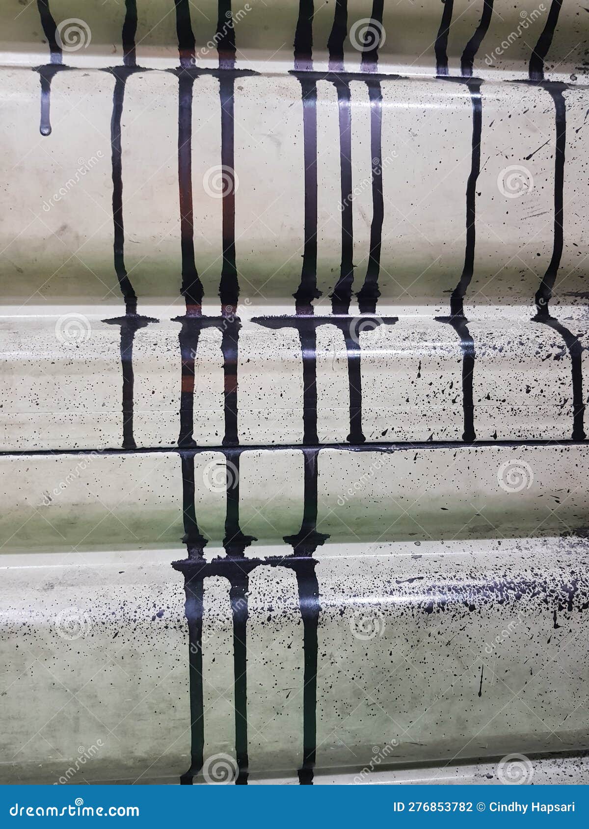 Drip and Melt Pattern of Black Paint on a Pale Yellow Background Stock ...