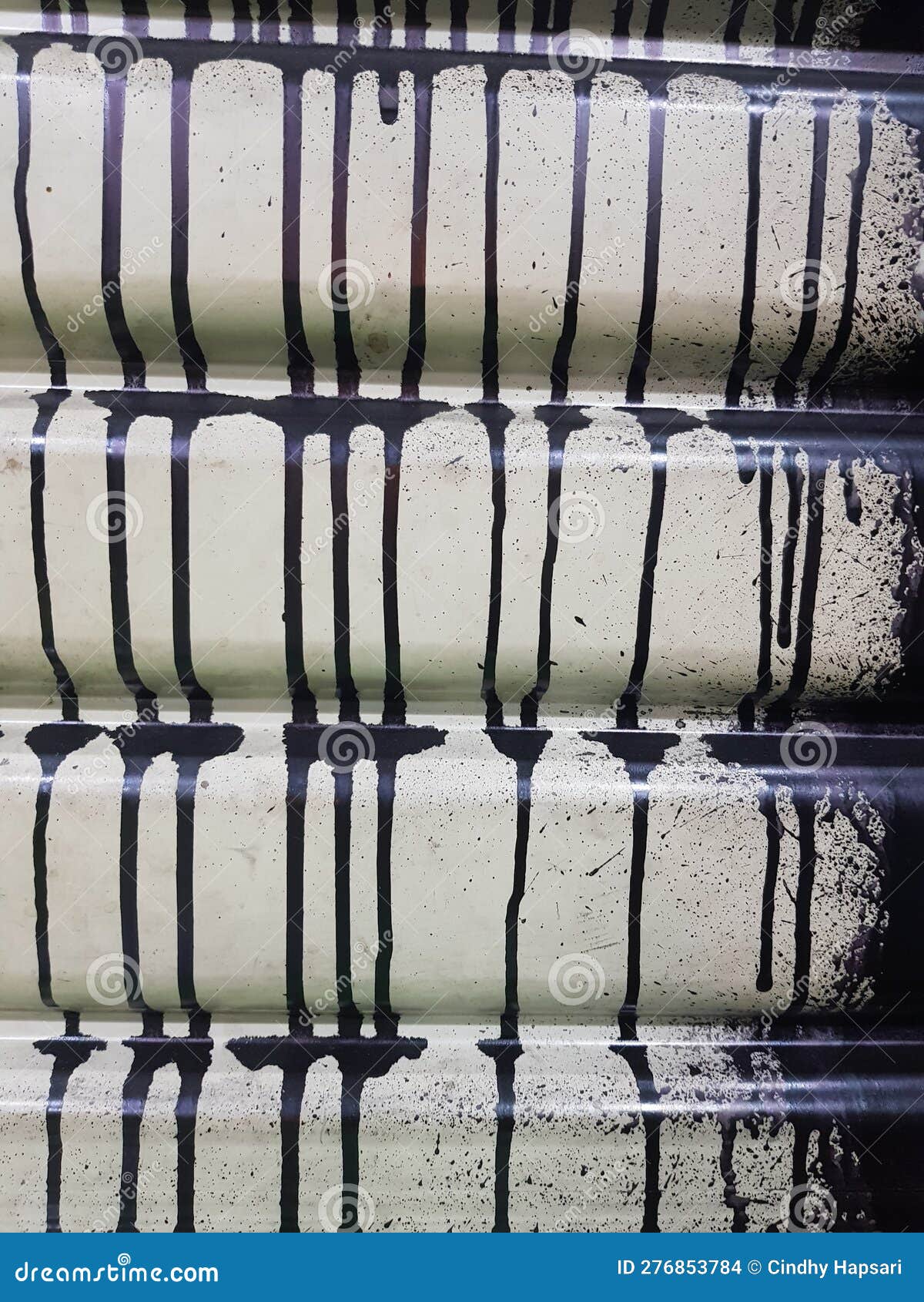 Drip and Melt Pattern of Black Paint on a Pale Yellow Background Stock ...