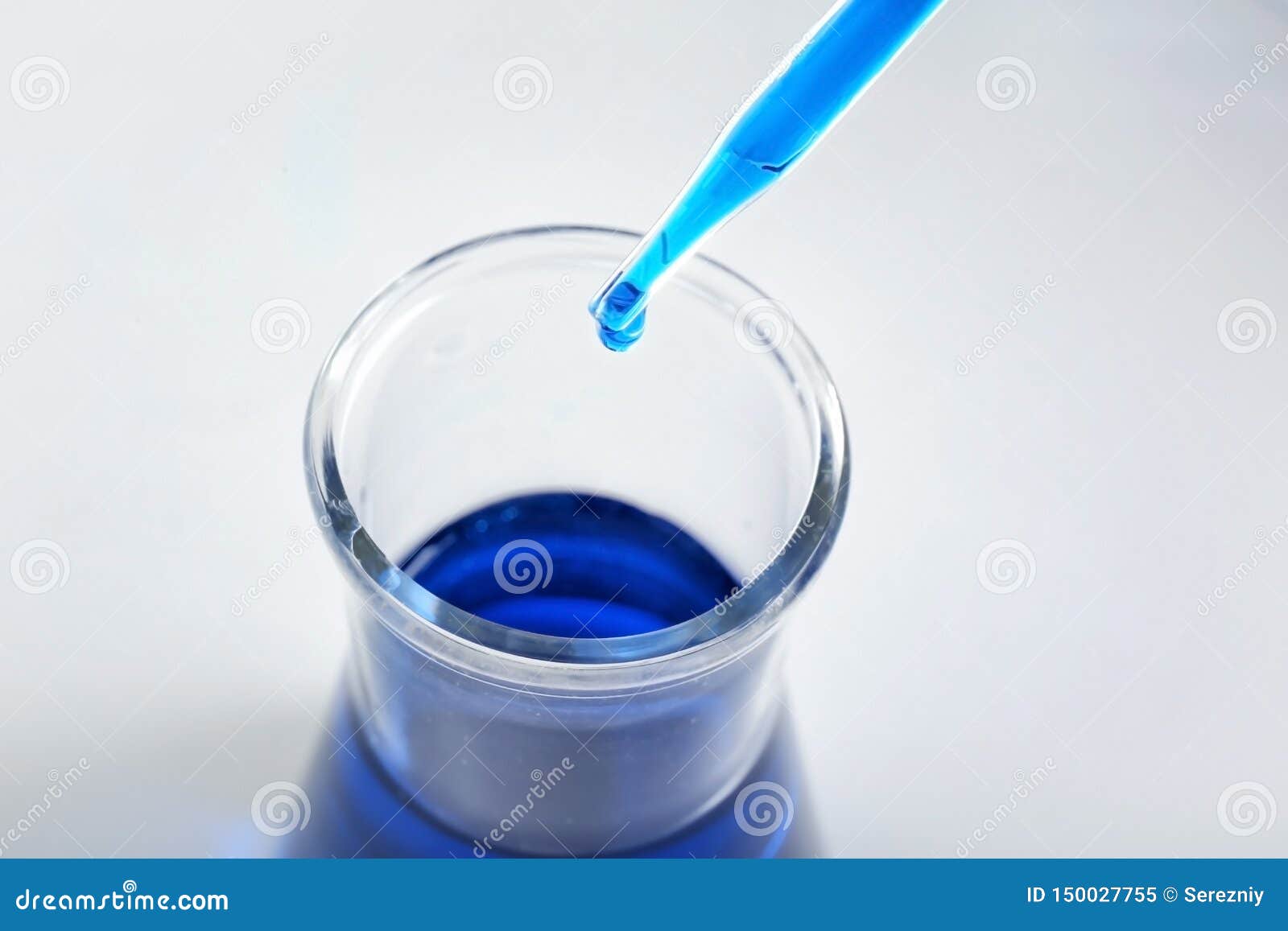 Dripping Blue Liquid into Flask on Light Background Stock Image - Image ...