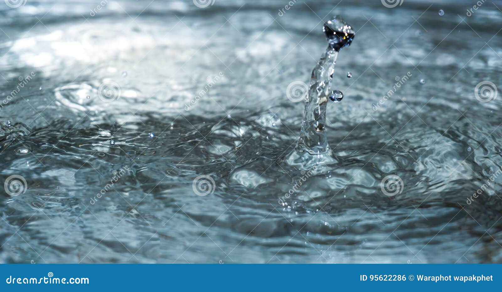 Dripping Down from the Roof of the House Makes the Water Below D Stock ...
