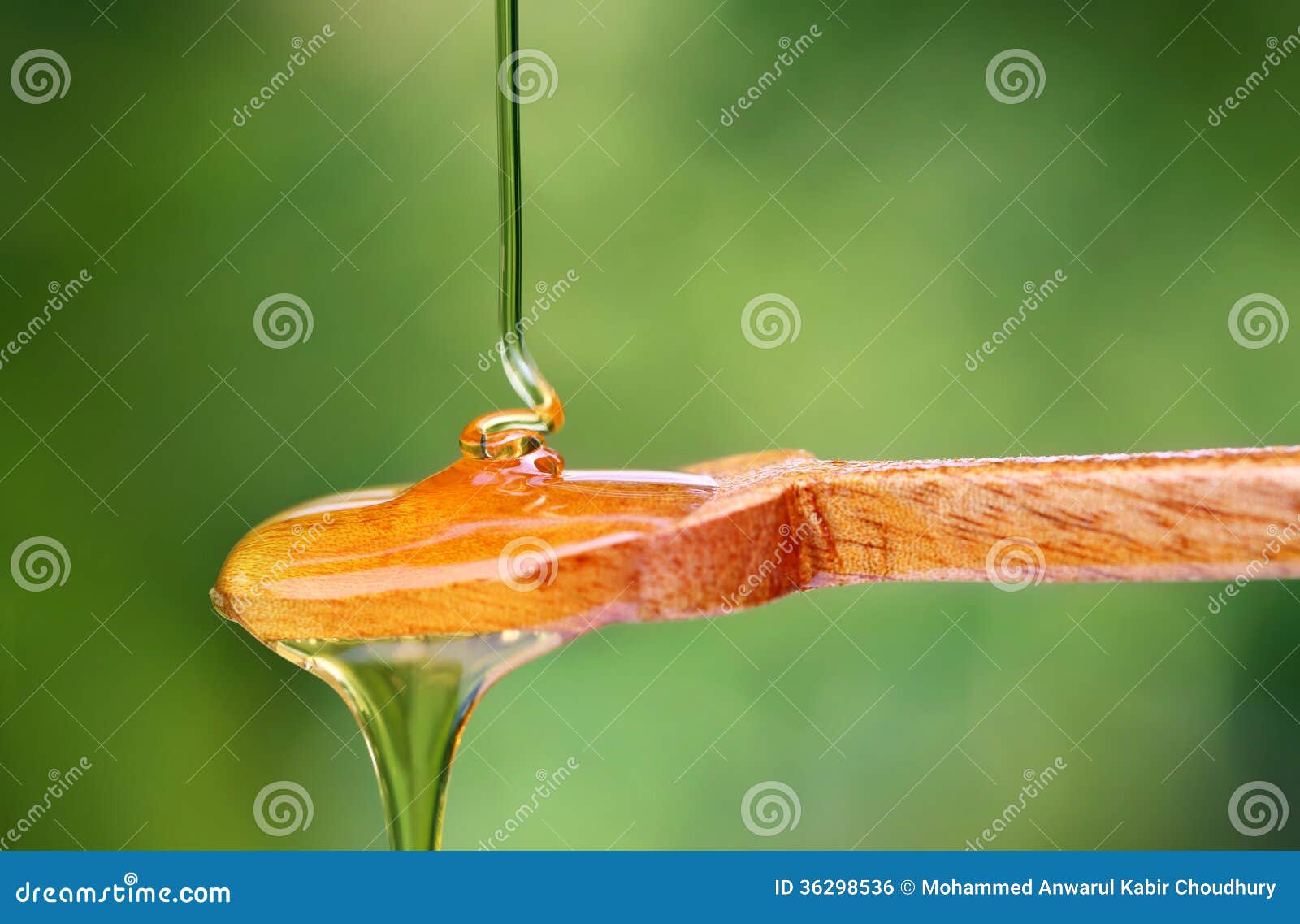 Dripping Honey on Wooden Spoon Stock Photo - Image of closeup, natural ...