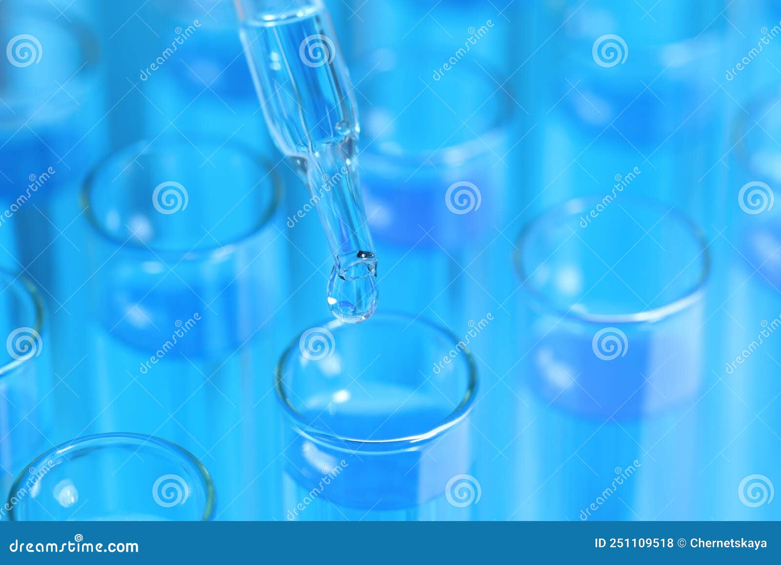 Dripping Reagent into Test Tube with Blue Liquid, Closeup. Laboratory ...