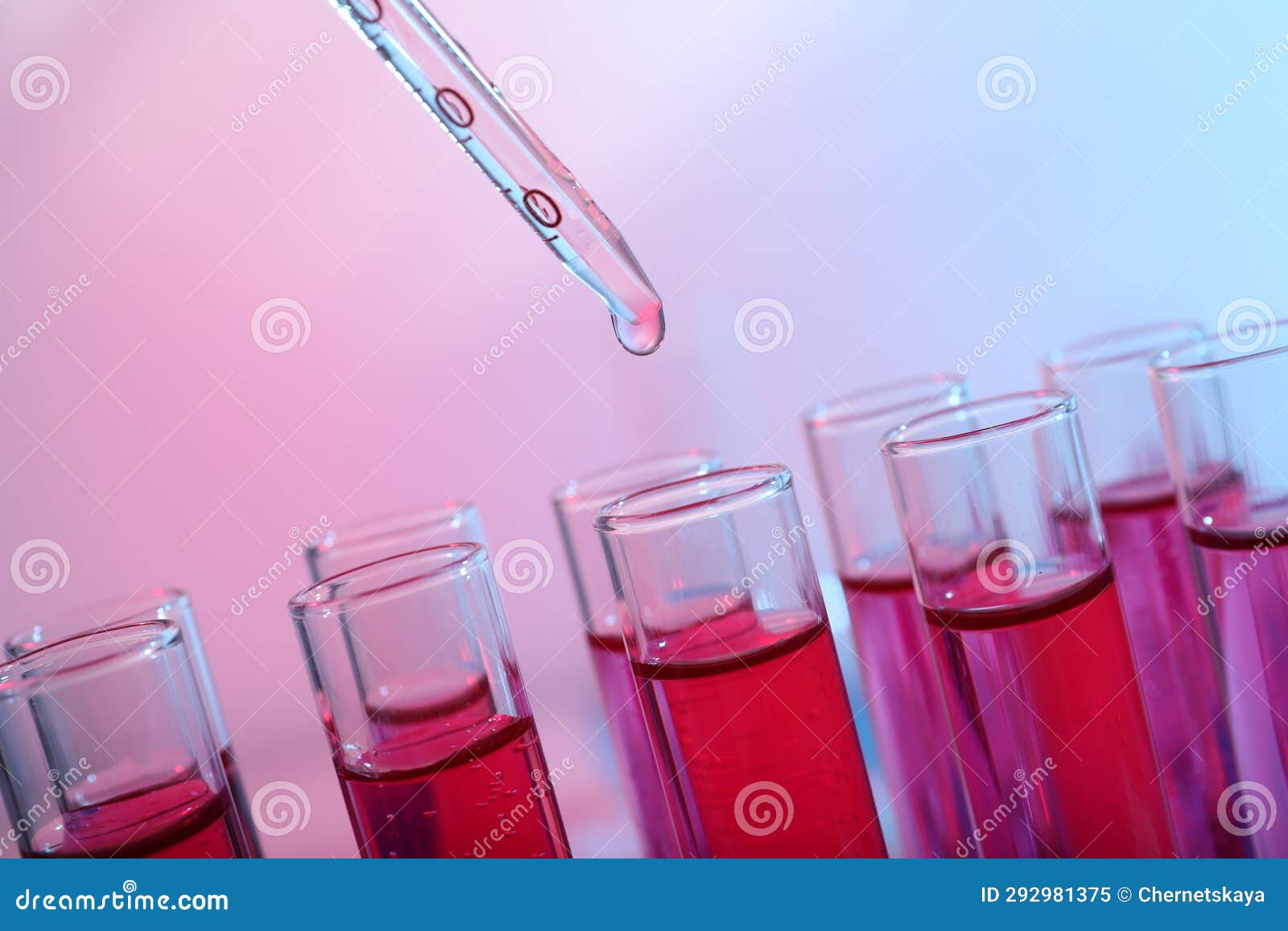 Dripping Reagent into Test Tube with Red Liquid, Closeup. Laboratory ...