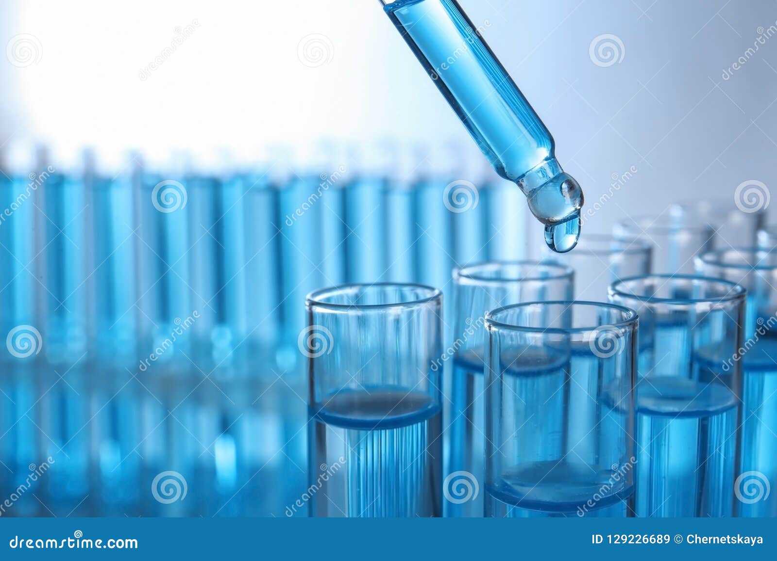 Dripping Reagent into Test Tube with Sample, Closeup Stock Image ...