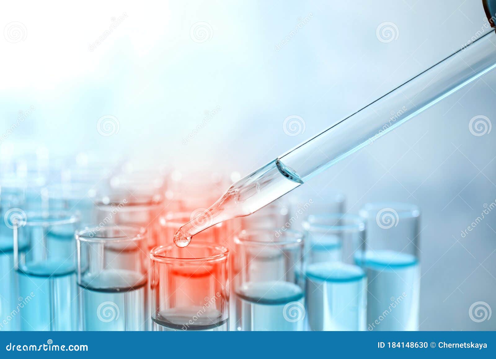 Dripping Sample into Test Tube with Liquid. Laboratory Analysis Stock ...