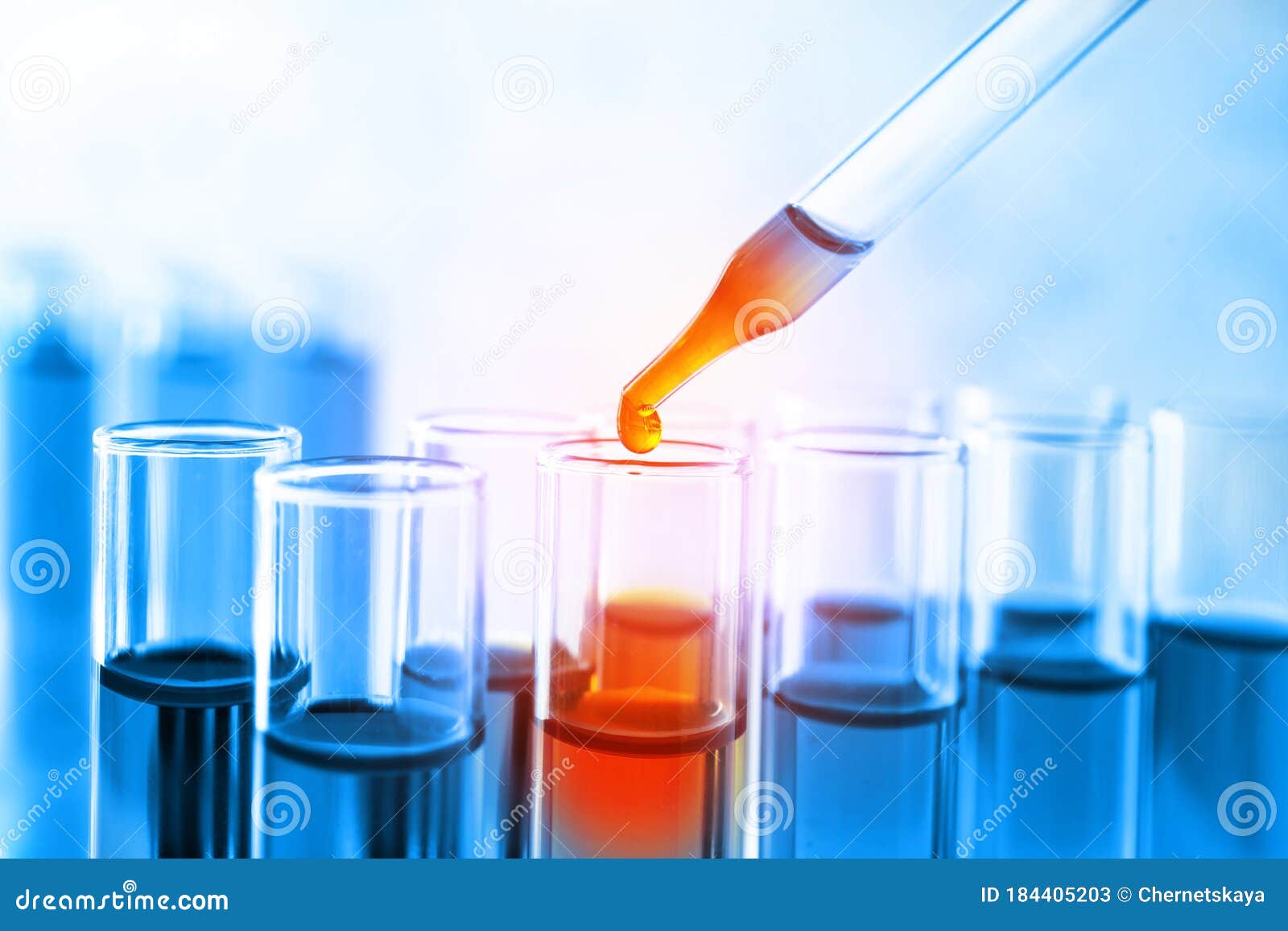 Dripping Sample into Test Tube with Liquid. Laboratory Analysis Stock ...