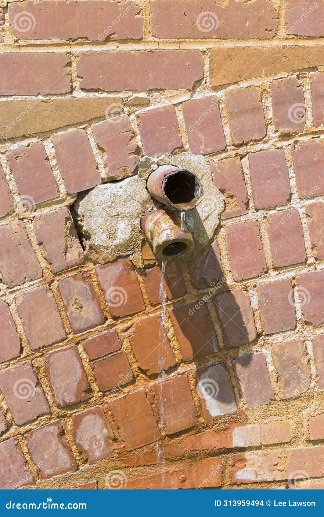 Dripping Water from a Pipe in a Brick Wall Stock Photo - Image of pipe ...