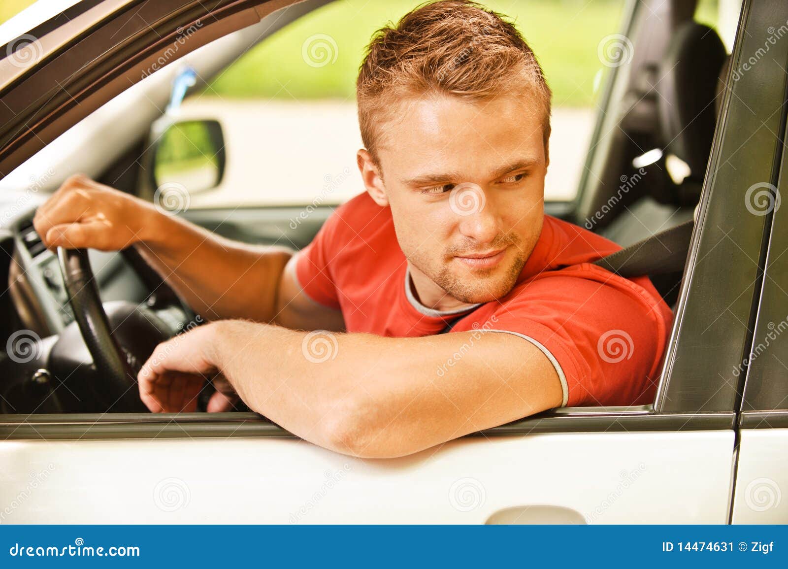 Driver of car looks back stock image. Image of clothing - 14474631