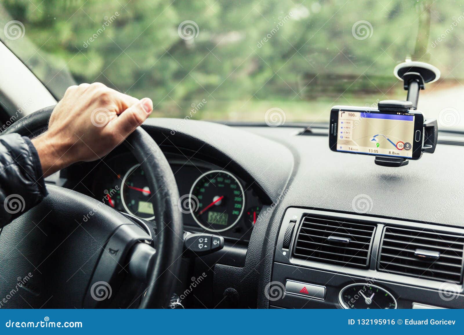 A Driver in a Car Performs Tasks Necessary To Steer the Vehicle Stock ...