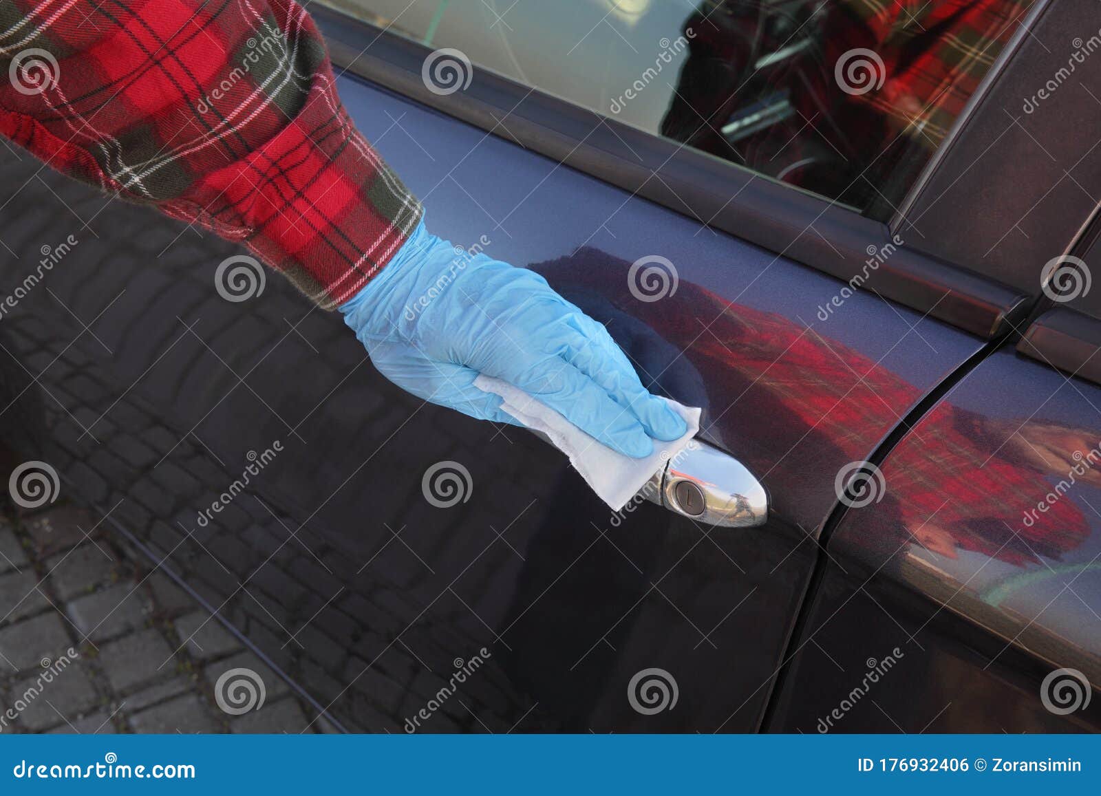 Driver Cleaning Car Handle Using Antibacterial Solution and Wet Wipes ...