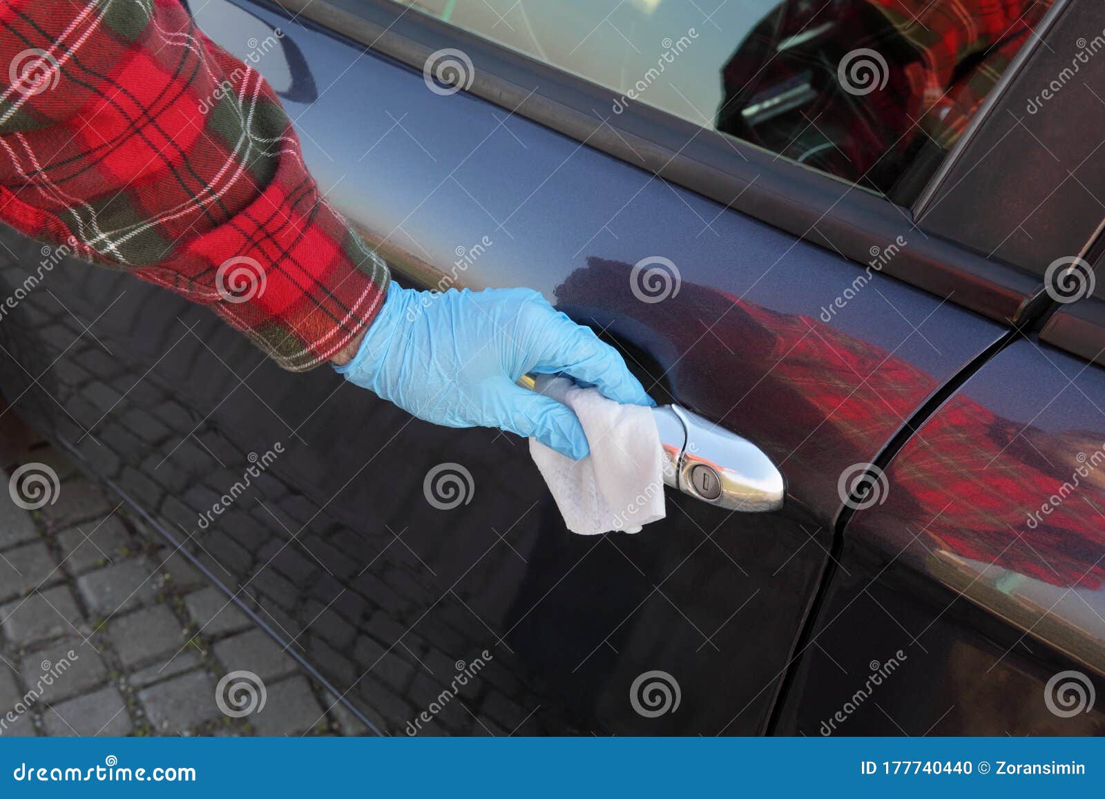 Driver Cleaning Car Handle Using Antibacterial Solution and Wet Wipes ...