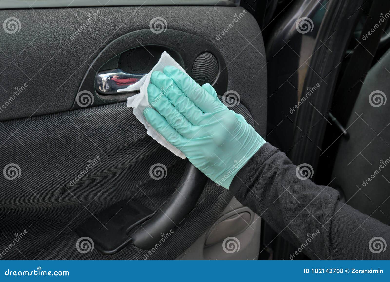 Driver Cleaning Car Handle Using Antibacterial Solution and Wet Wipes ...