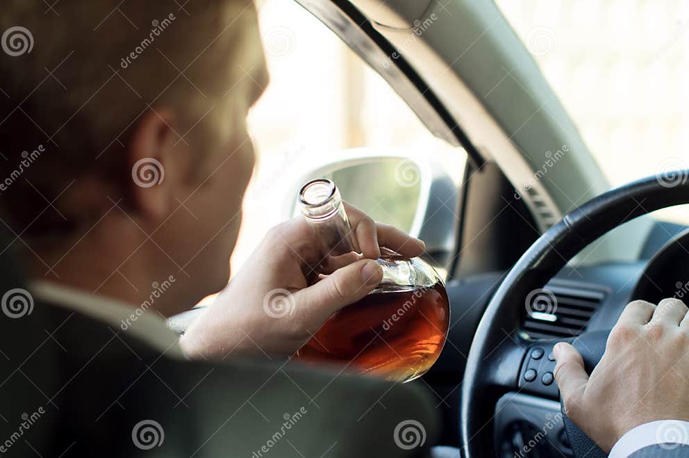 Driver Drinks Alcohol while Driving Stock Image - Image of intoxicated ...