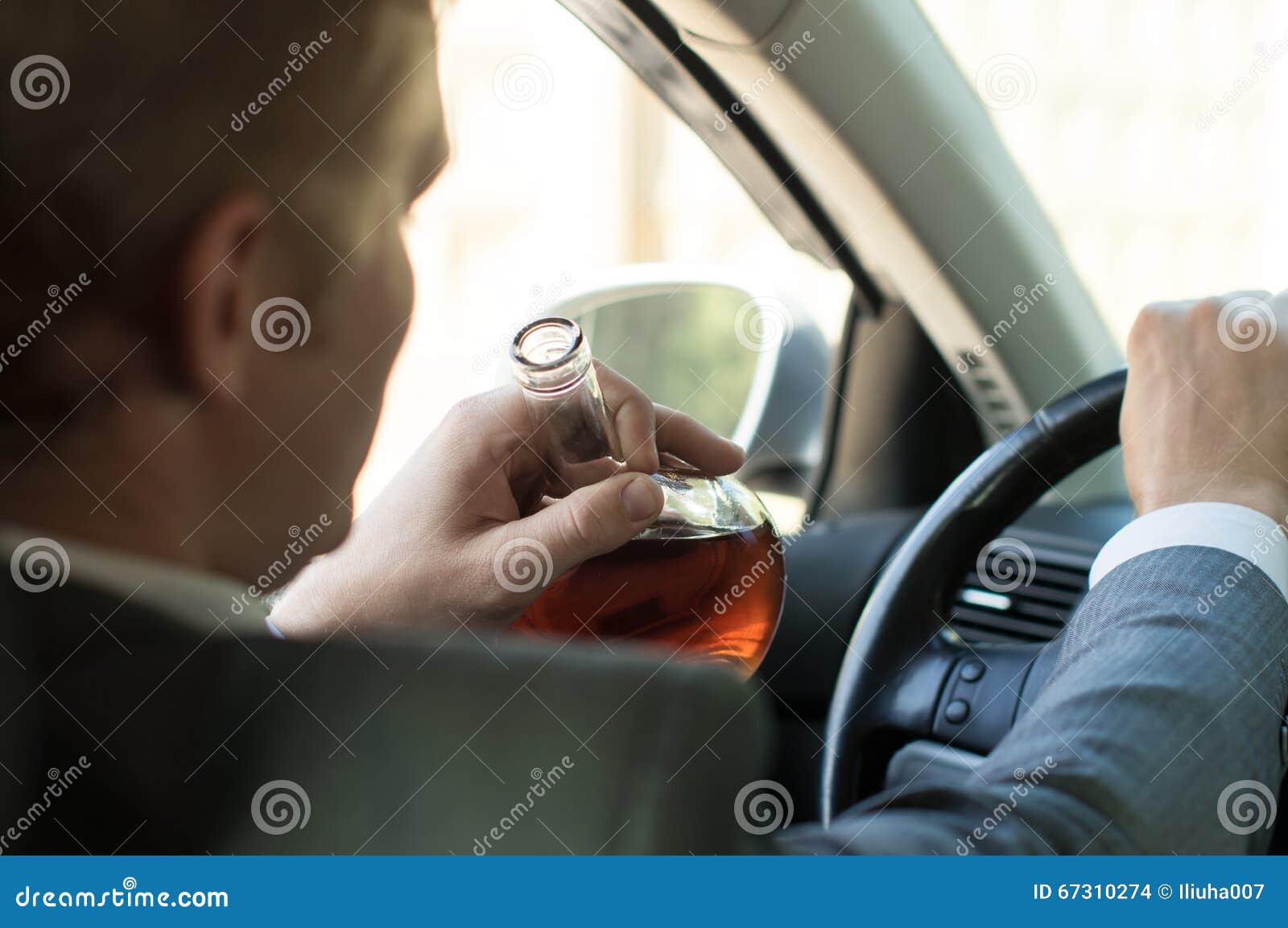Driver Drinks Alcohol Driving a Car Stock Photo - Image of dangerous ...