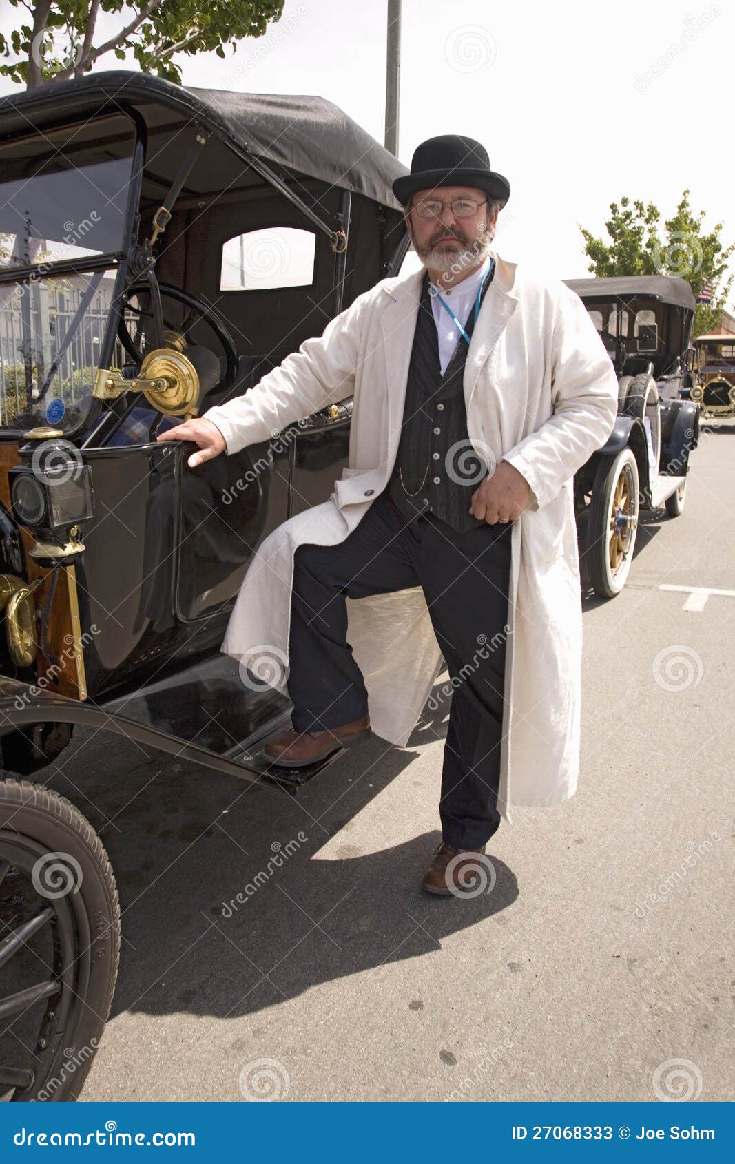 Driver in Driving Clothes Posing in Front of Antique Car Editorial ...