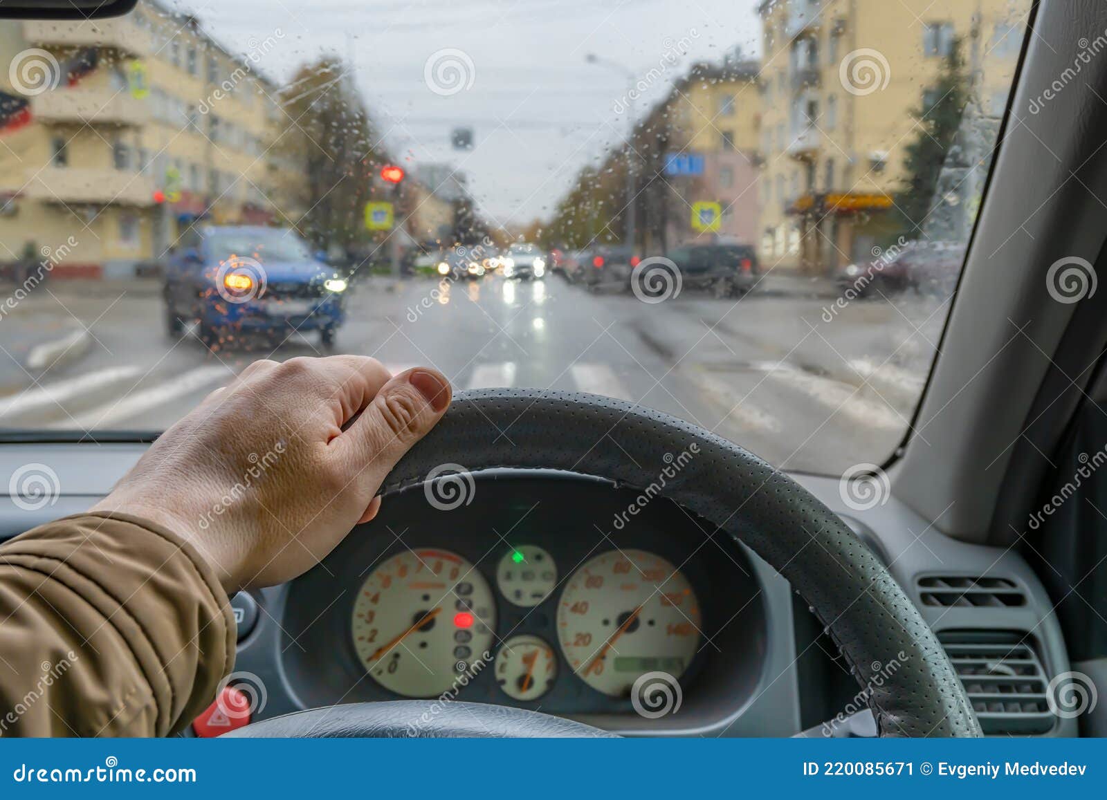 Driver Hand on the Steering Wheel Inside the Car while Parking at a ...