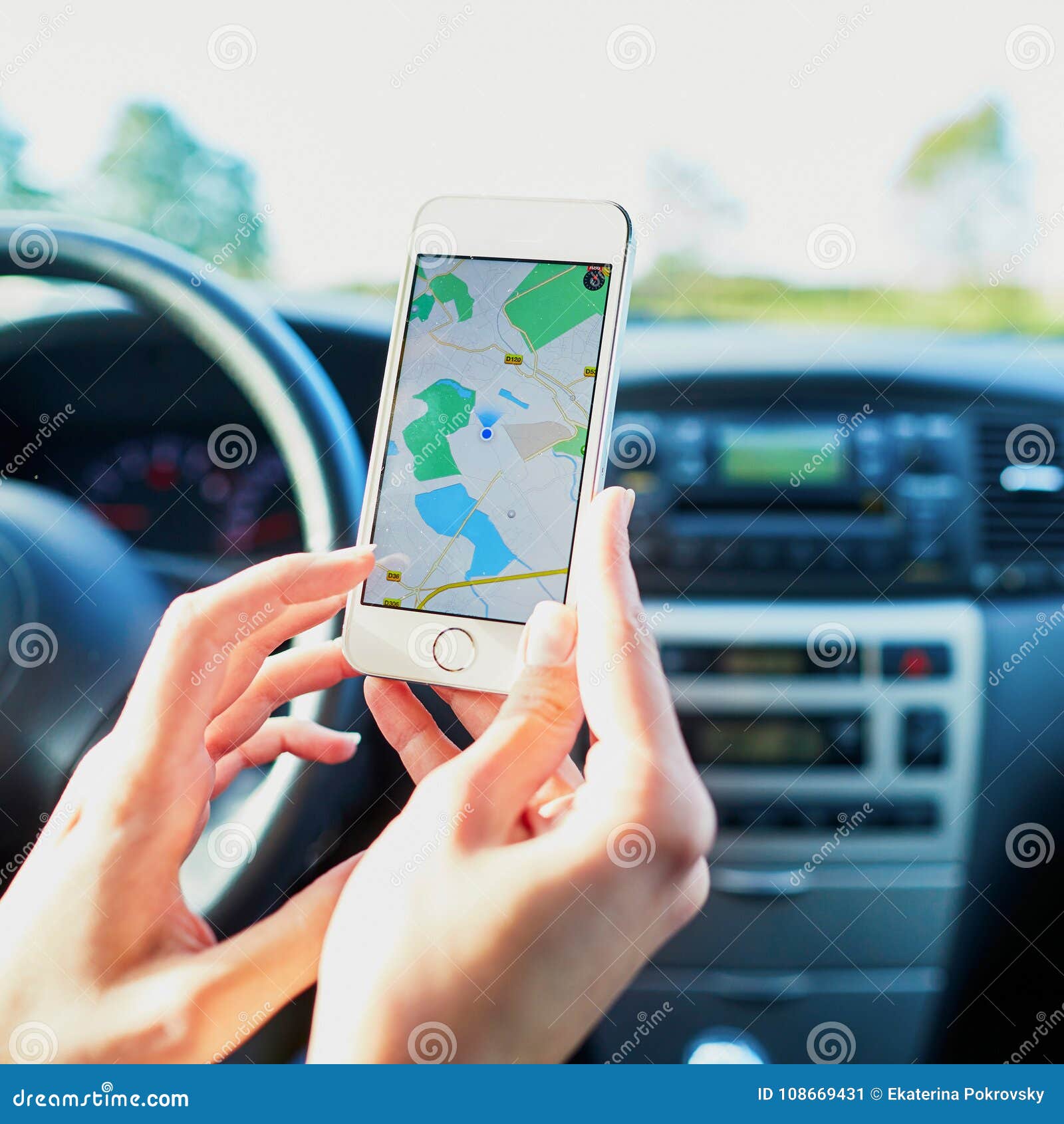 Driver Hands Holding a Phone with Navigator on a Screen Stock Image ...