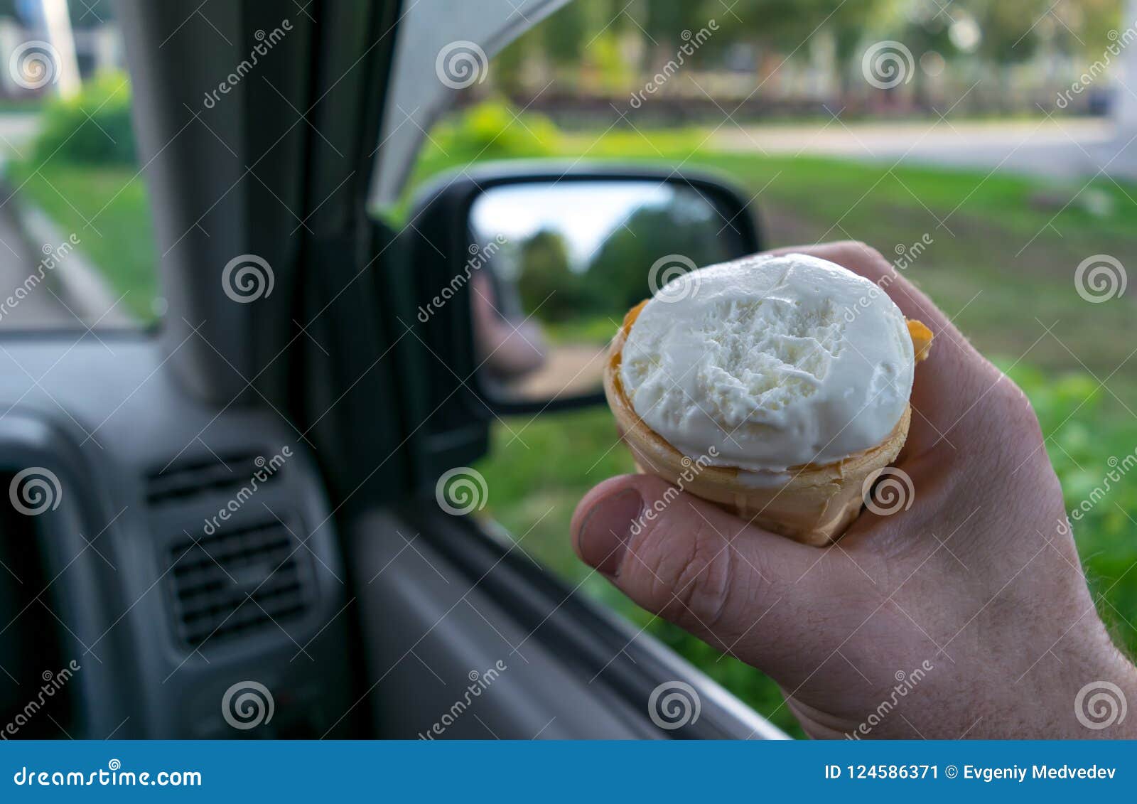 Driver Holds the Ice Cream while Driving a Car Stock Image - Image of ...