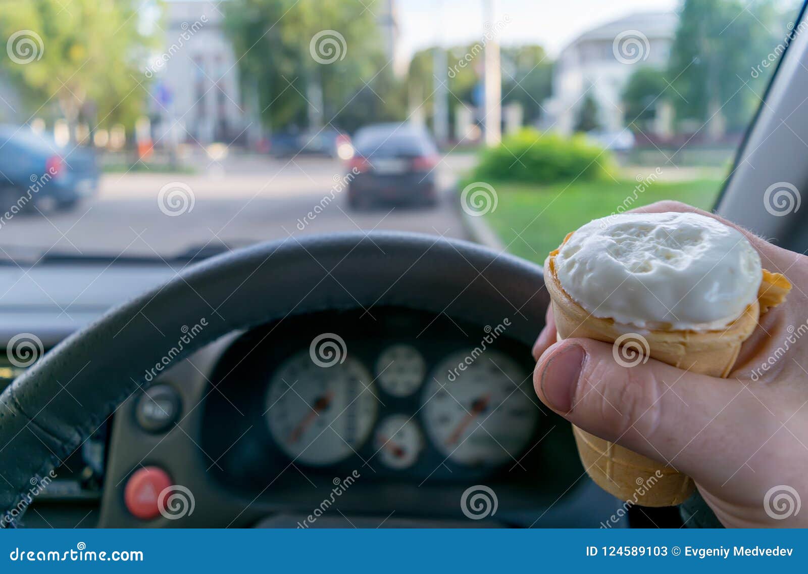 Driver Holds the Ice Cream while Driving a Car Stock Image - Image of ...