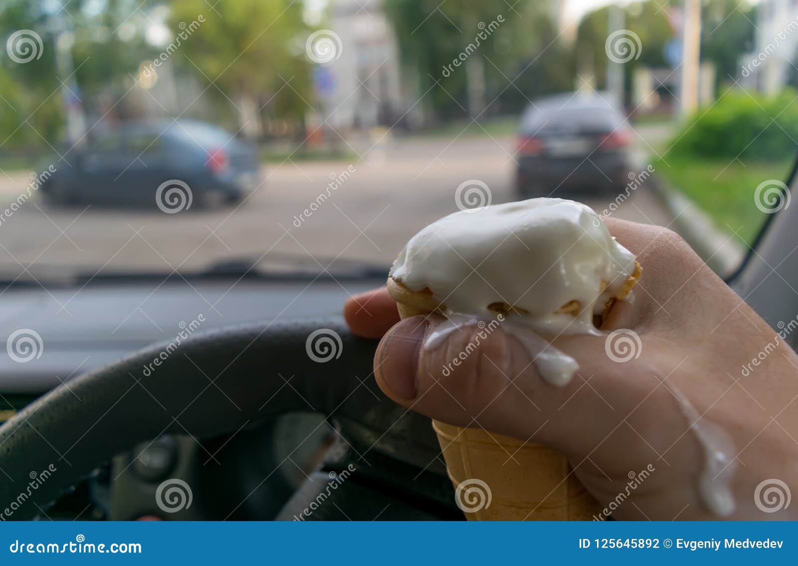 Driver Holds the Ice Cream while Driving a Car Stock Photo - Image of ...