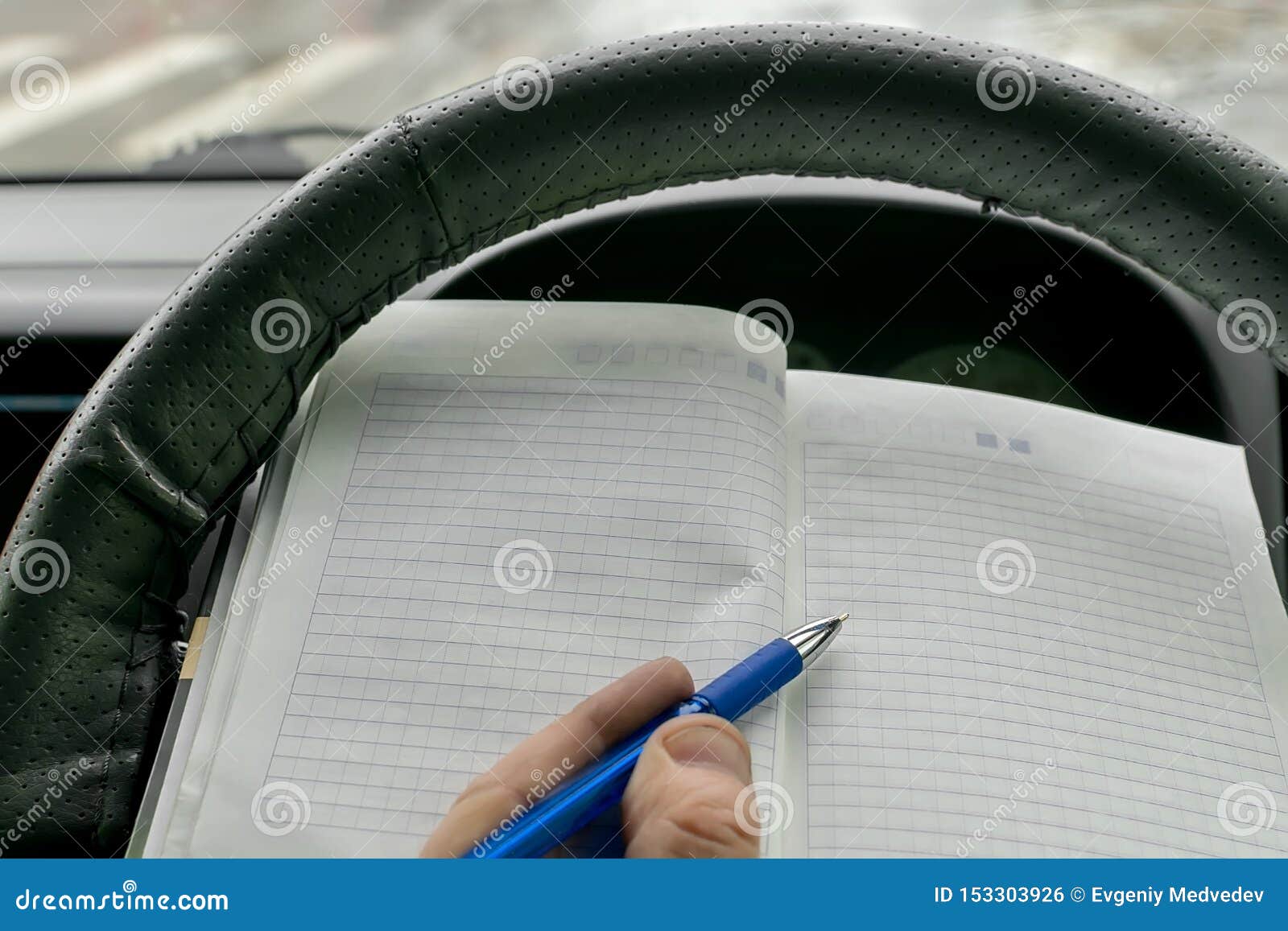 Driver Holds a Paper Notebook and Makes Notes Stock Photo - Image of ...