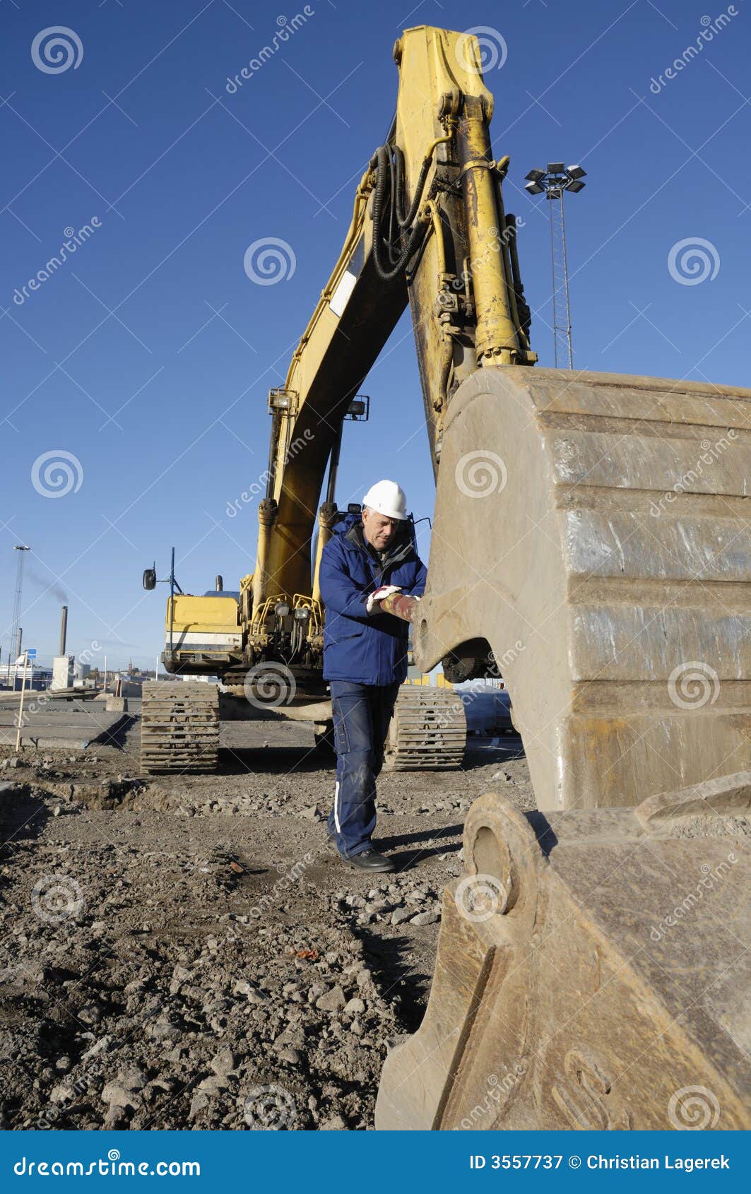 Driver Inspecting His Digger Stock Image - Image of bulldozer, digger ...