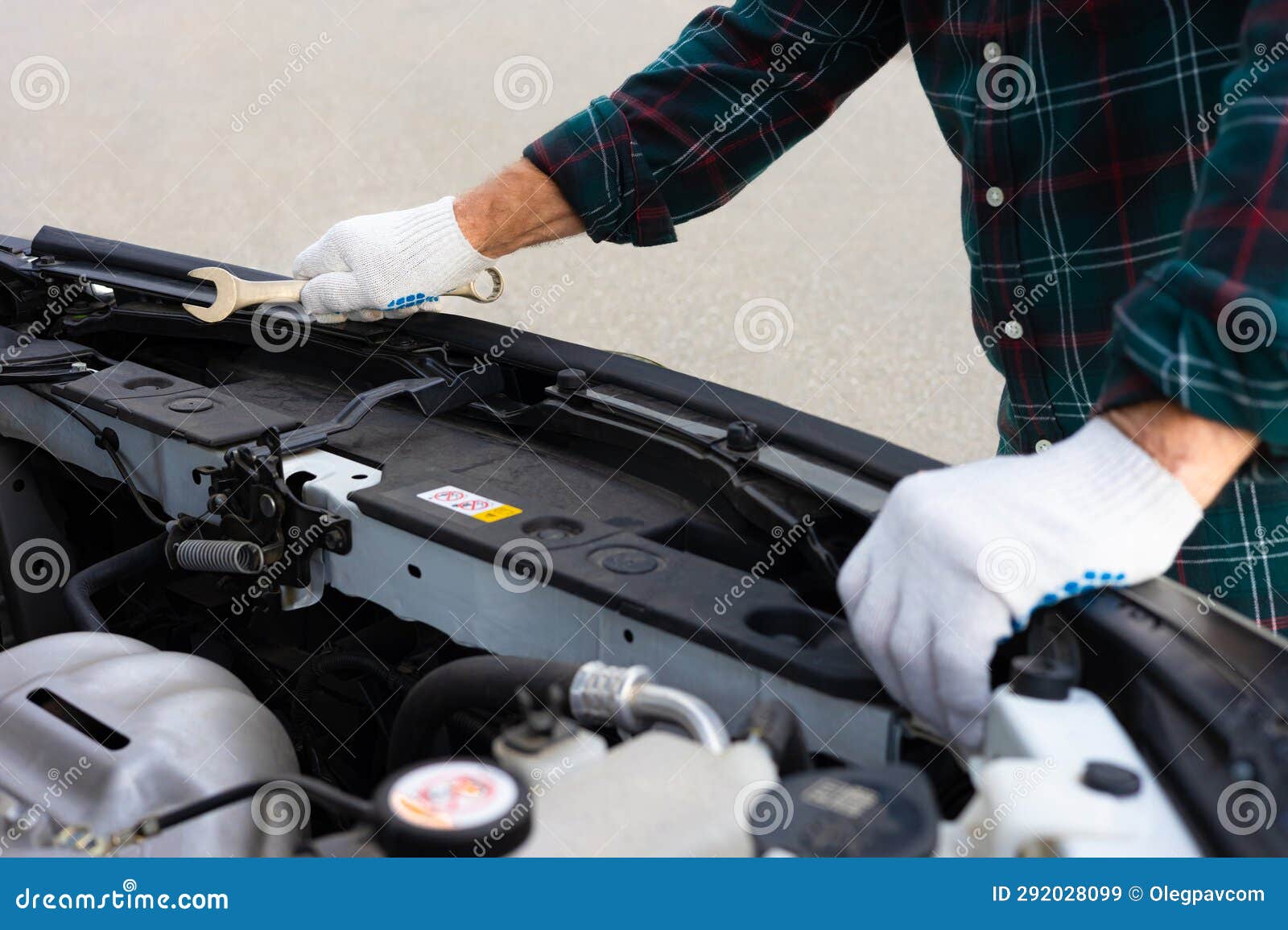 The Driver Inspects the Engine Compartment of the Car. Stock Image ...
