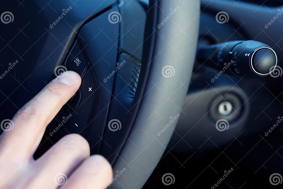 Driver Making Hands Free Call in Car with Button on Steering Wheel ...
