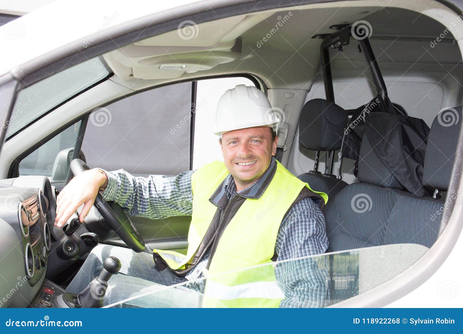 Man Workers on a Construction Site in Car Van Stock Photo - Image of ...