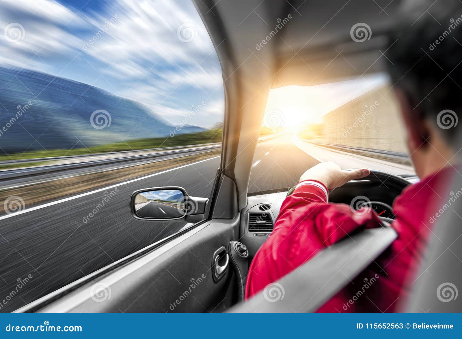 The Driver Rushes by Car Along the Road. Speed Race in Motion. Stock ...