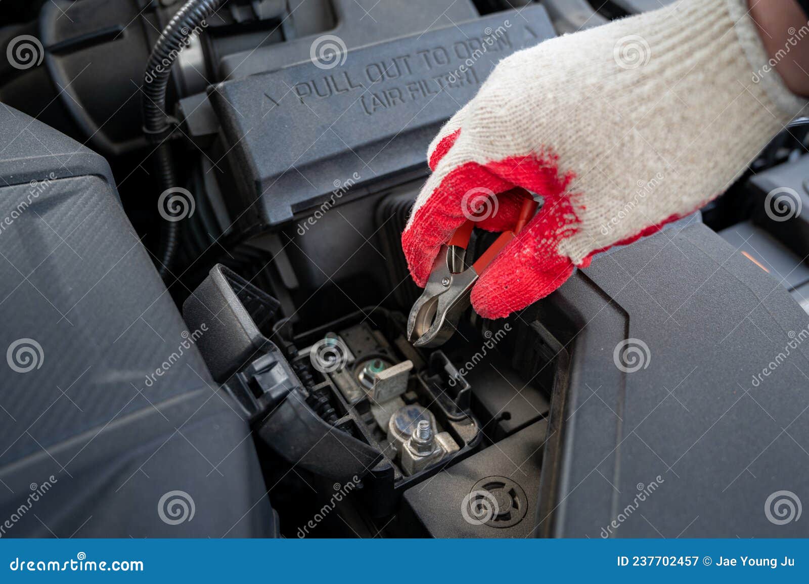 Driver`s Hand Checking the Condition of the Car`s Battery Stock Image ...