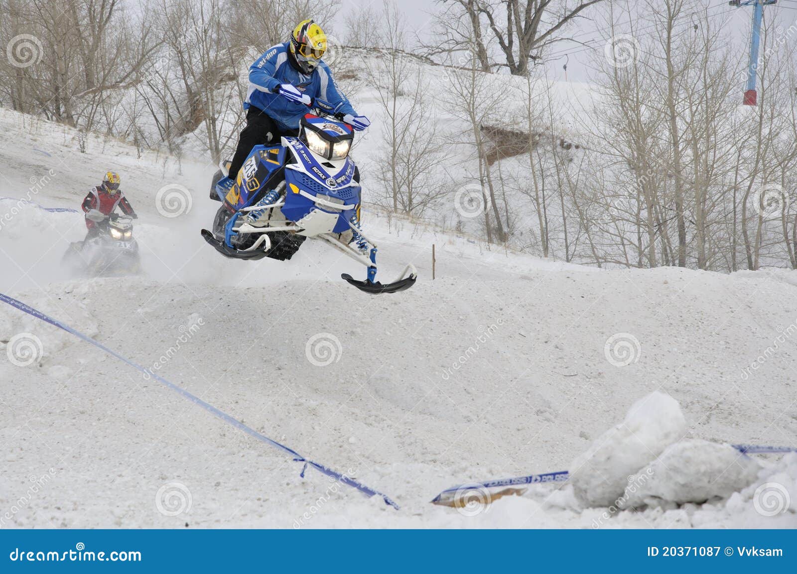 Driver on a Snowmobile Flying Down a Hill Editorial Photography - Image ...