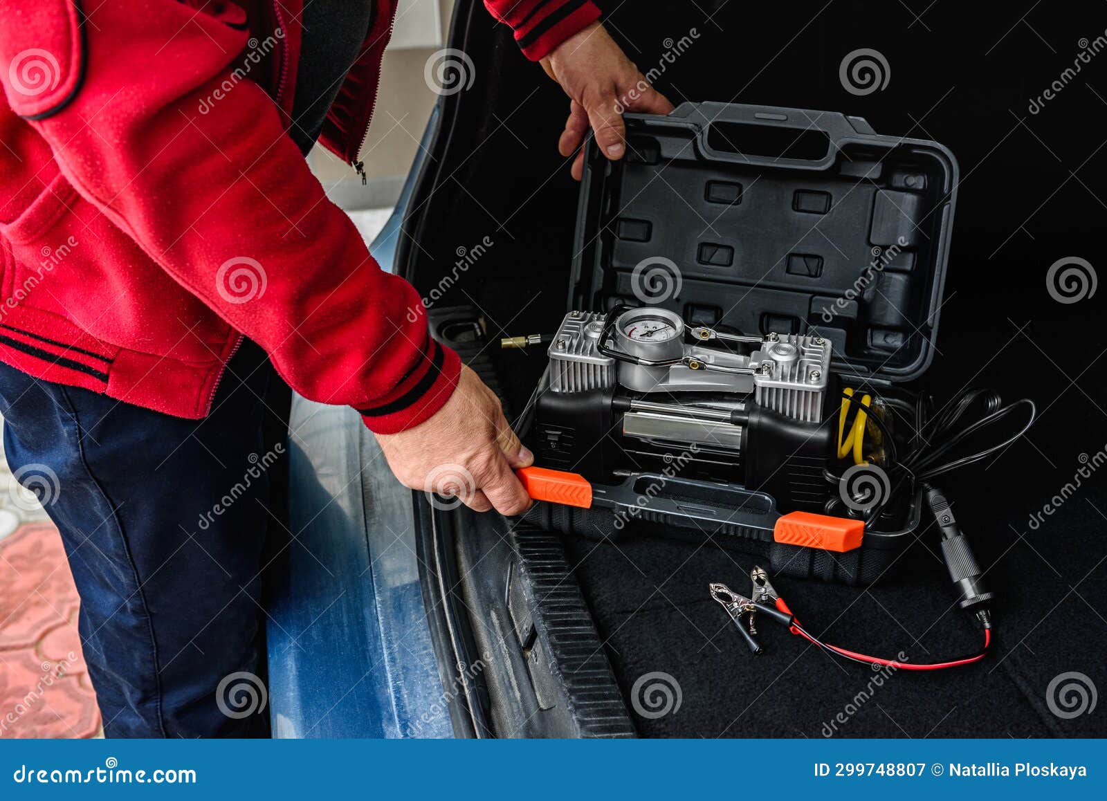 Driver Takes Vehicle Compressor in Trunk of Car. Stock Image - Image of ...