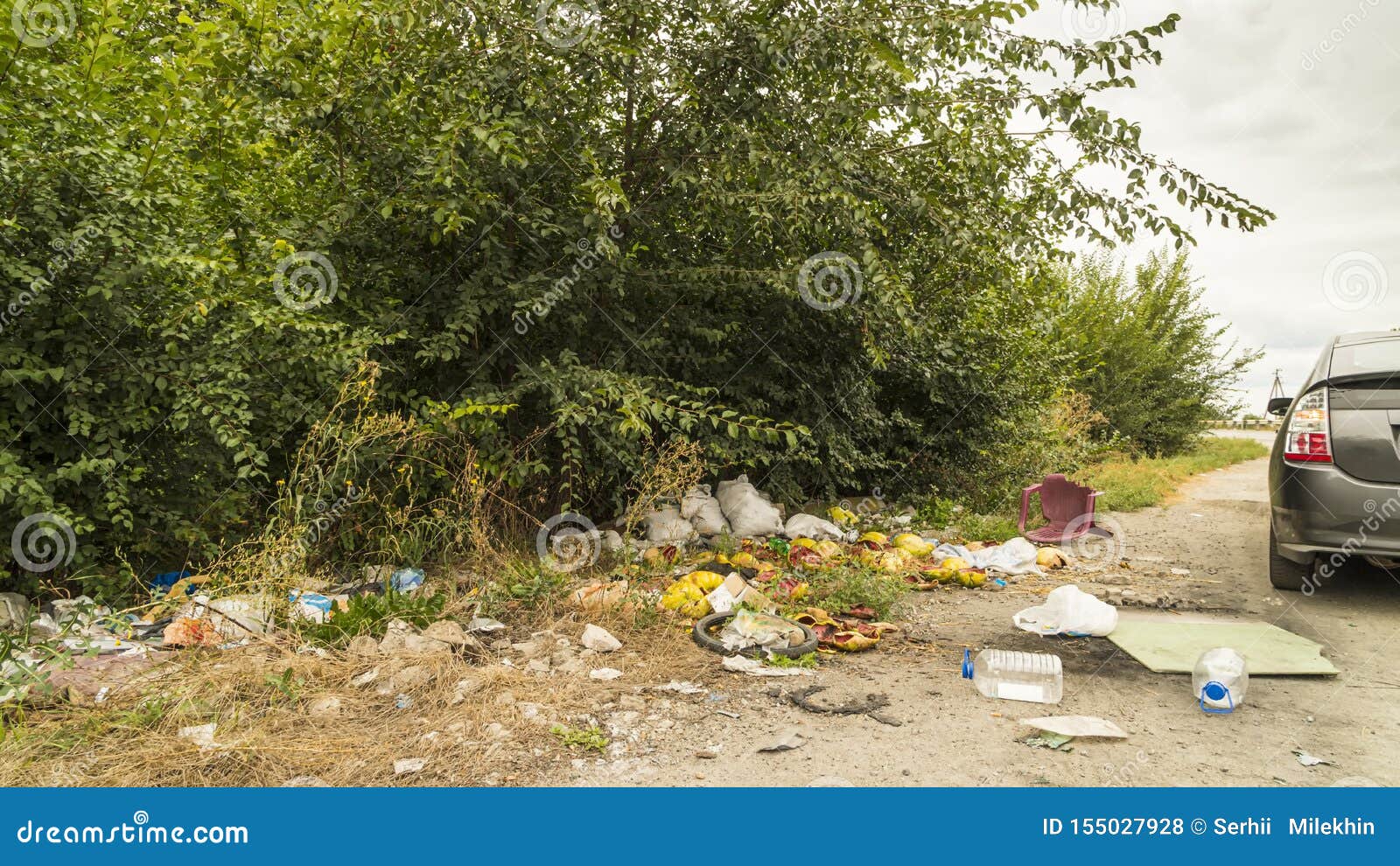 The Driver Throw Garbage on the Side of the Road. Stock Photo - Image ...