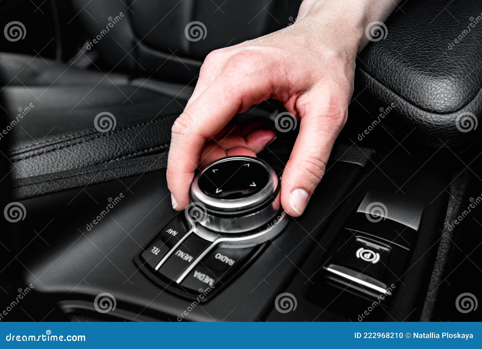 Driver Turning Media and Navigation Control Button of a Modern Car. Car ...