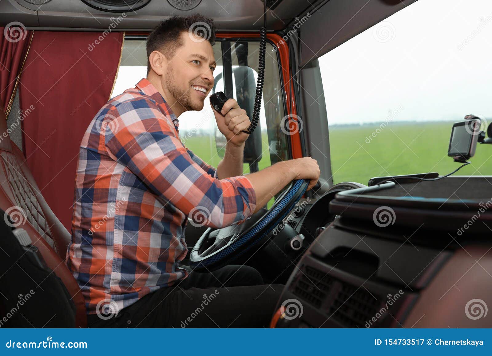 Driver Using CB Radio in Cab of Truck Stock Image - Image of person ...