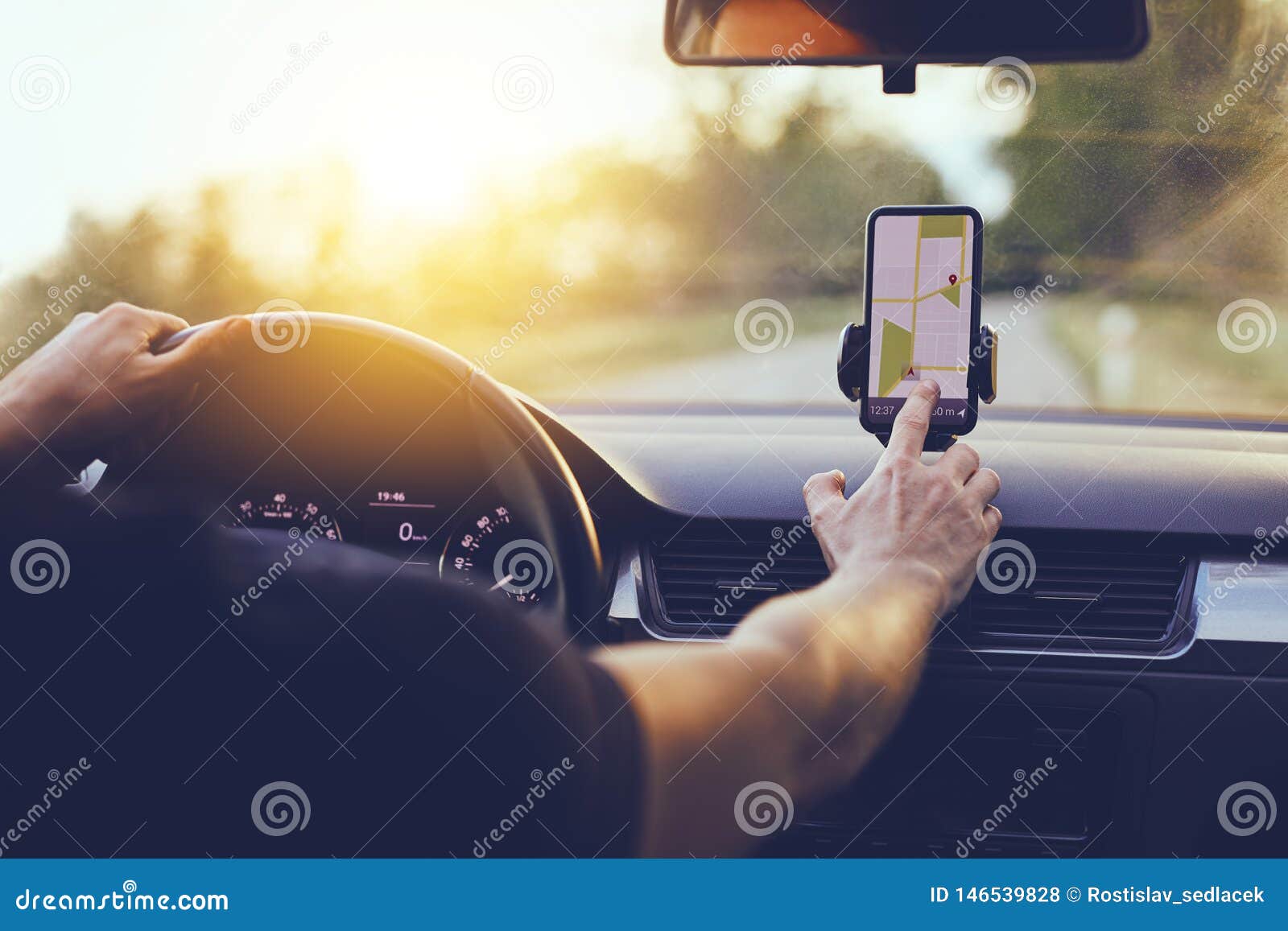 Driver Using GPS Navigation in Mobile Phone while Driving Car Stock ... Driver Using GPS Navigation in Mobile Phone while Driving Car Stock ...