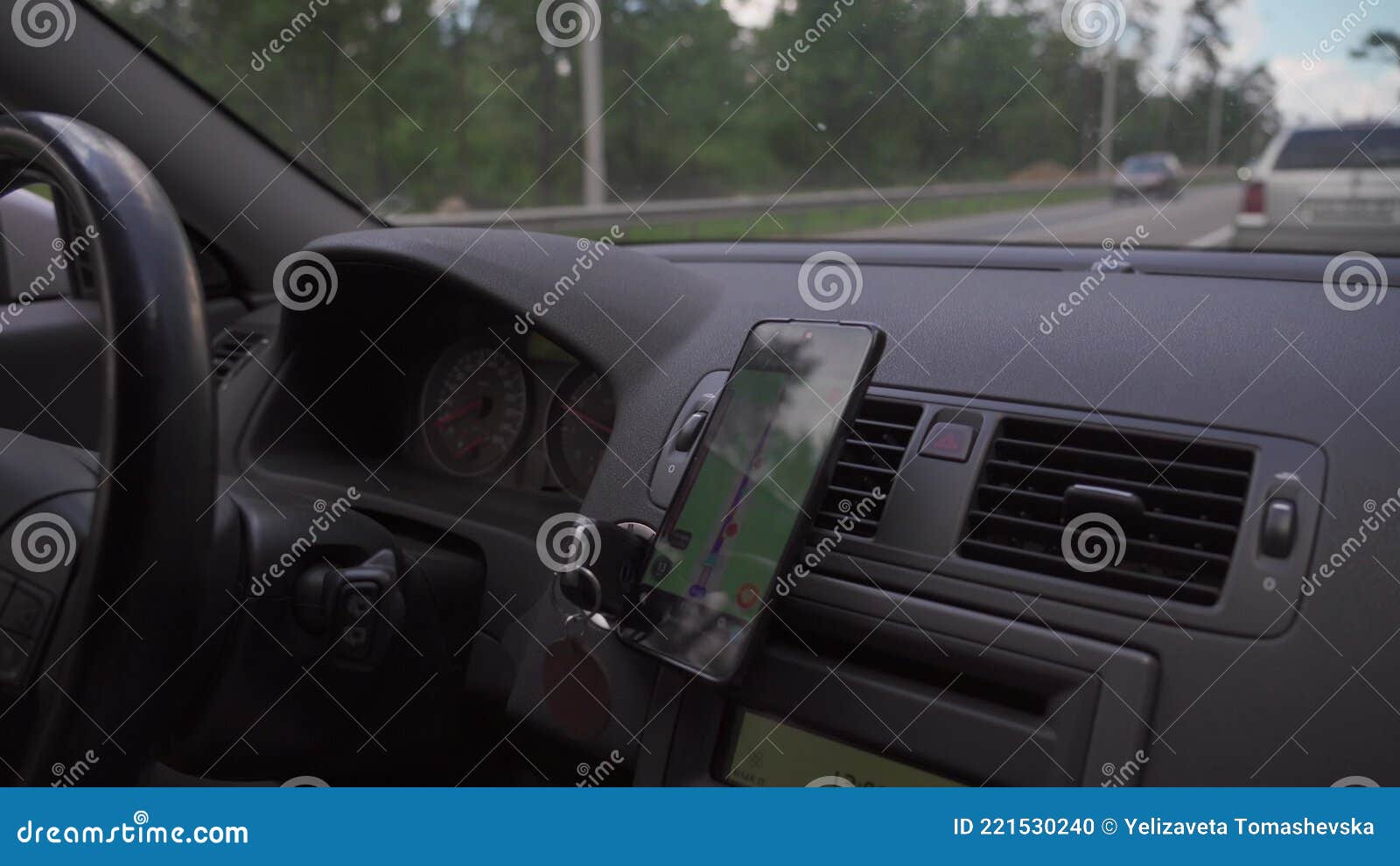 Driver Using Maps App for Showing Right Route on Smartphone Attached To ...