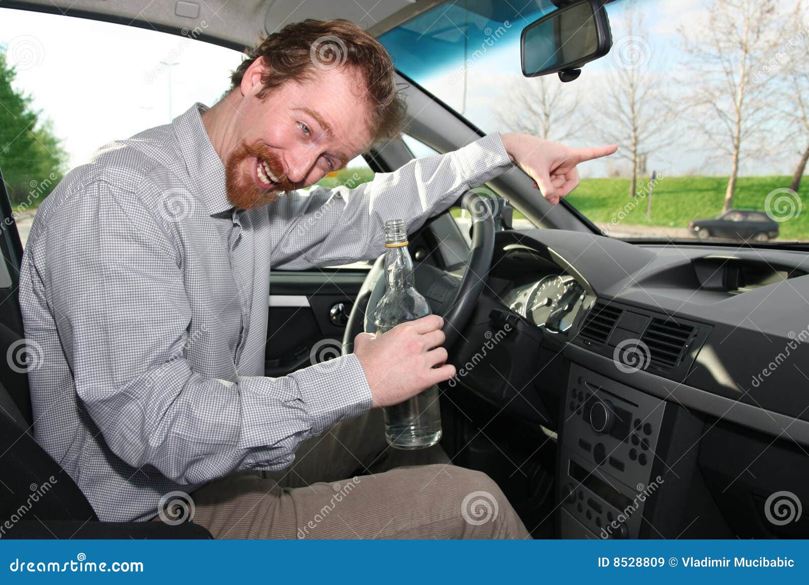 Drivers with a Bottle Alcohol Stock Image - Image of liquor, road: 8528809