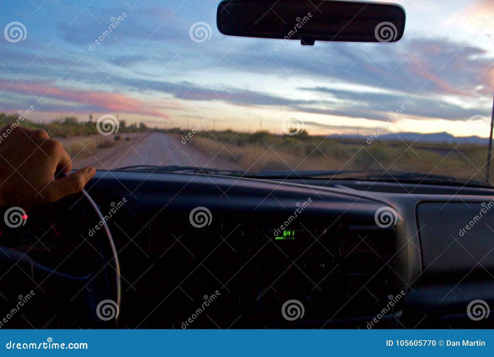 Drivers Point Of View Of The Road. Driver Holding Hands On Steering ...