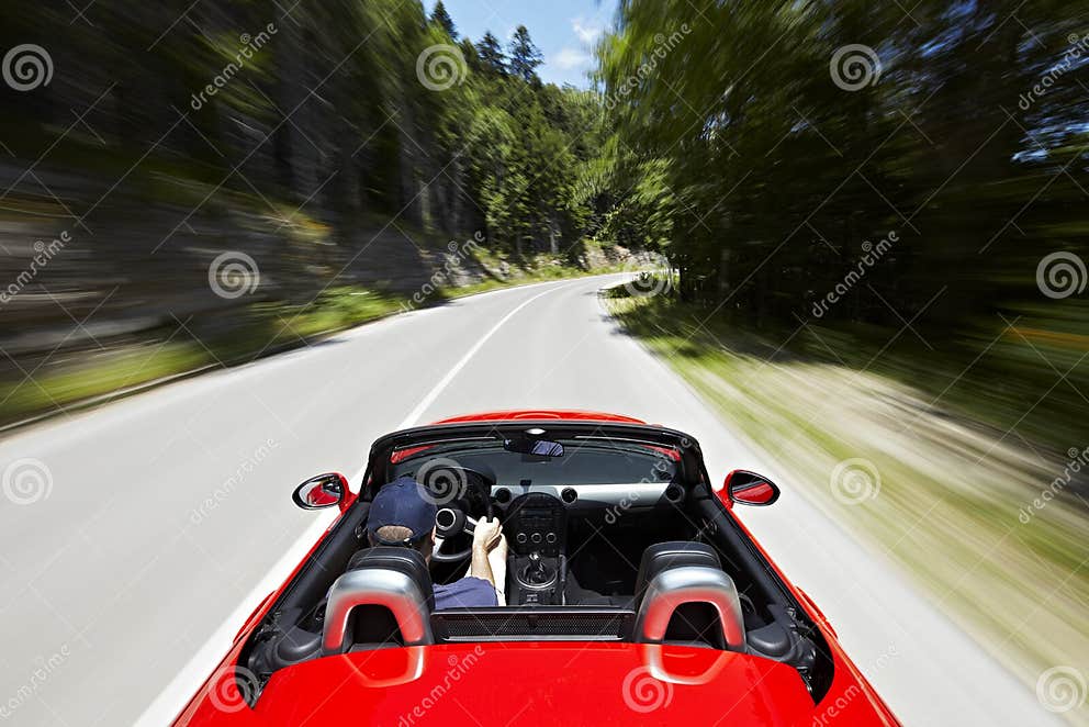 Driving in a cabriolet stock photo. Image of speeding - 23415908