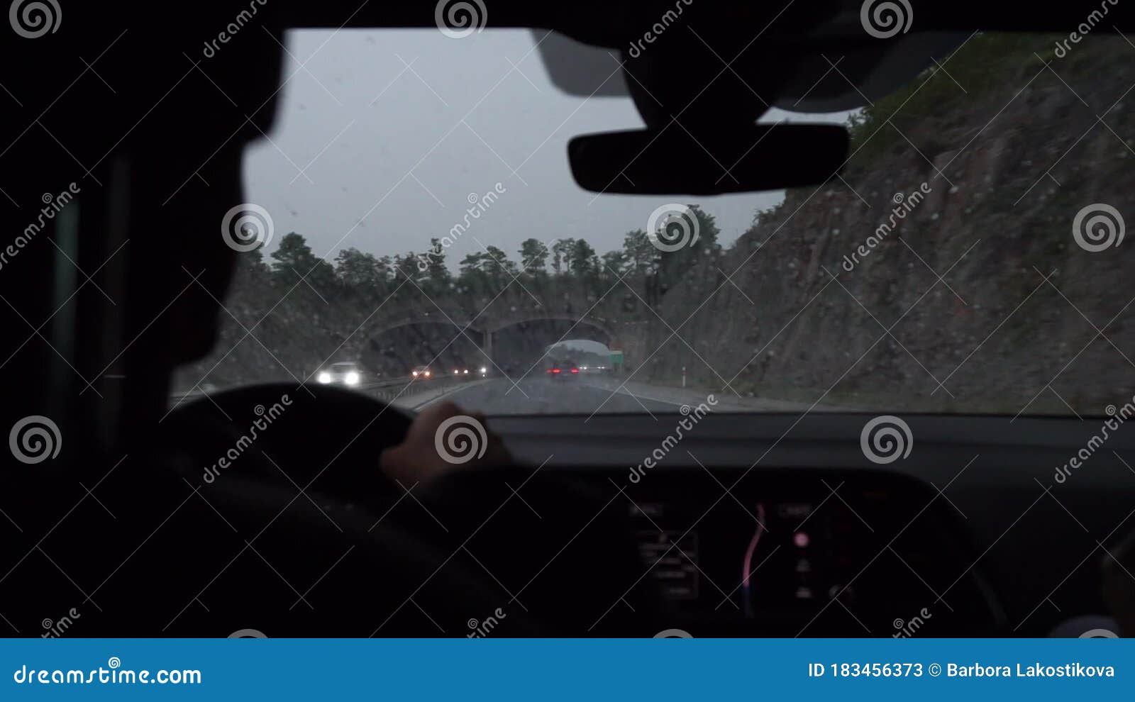 Driving a Car on a Bad Weather with Lightning in Background - Medium ...