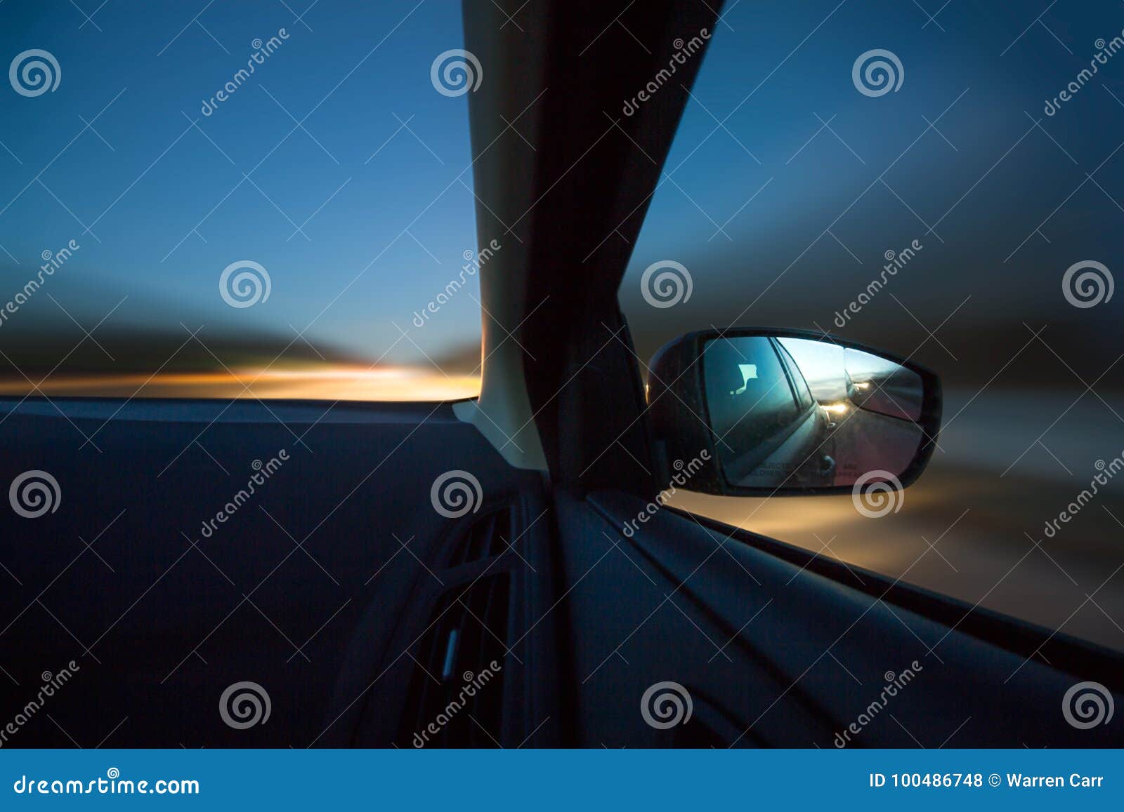 Driving Car at Dusk stock photo. Image of business, automobile - 100486748