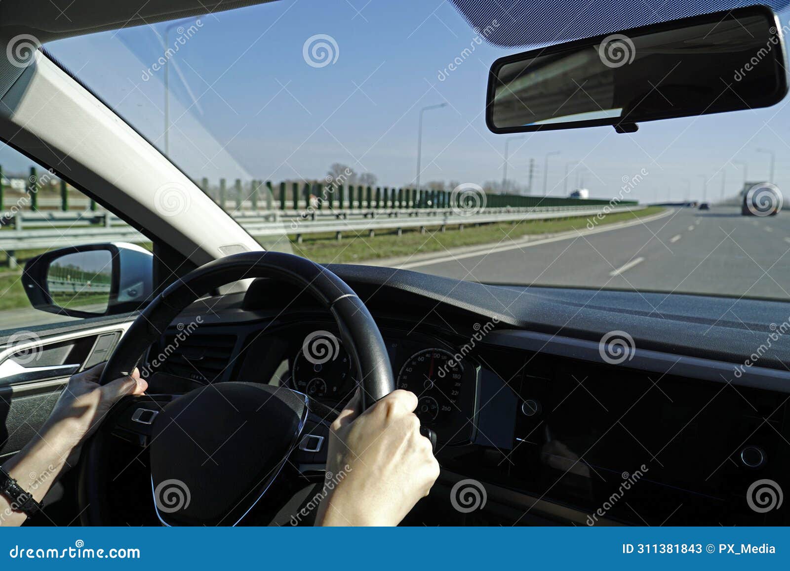 Driving a car on a highway stock image. Image of motorway - 311381843