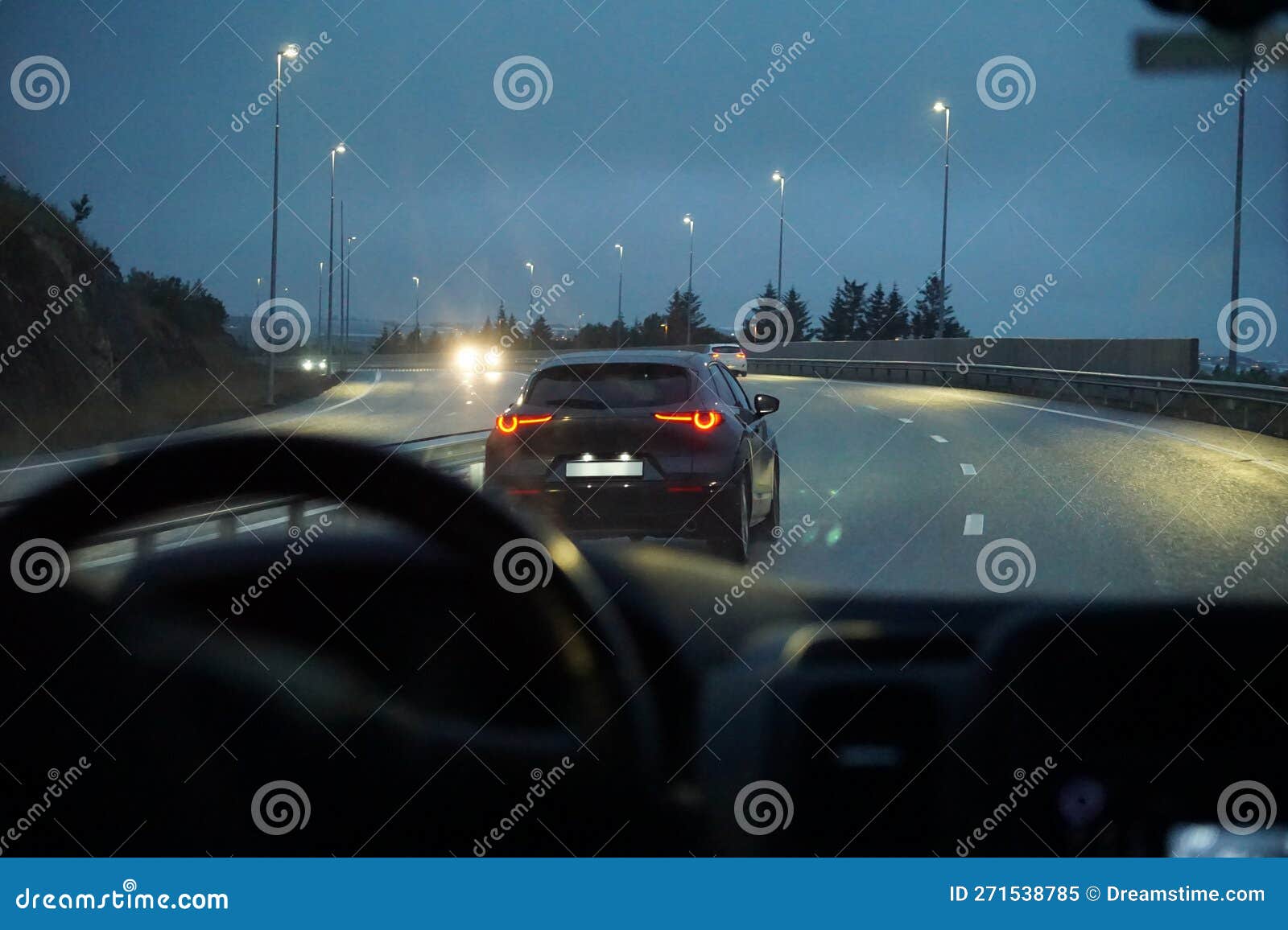 Driving a Car on a Highway in the Evening or at Night Stock Image ...